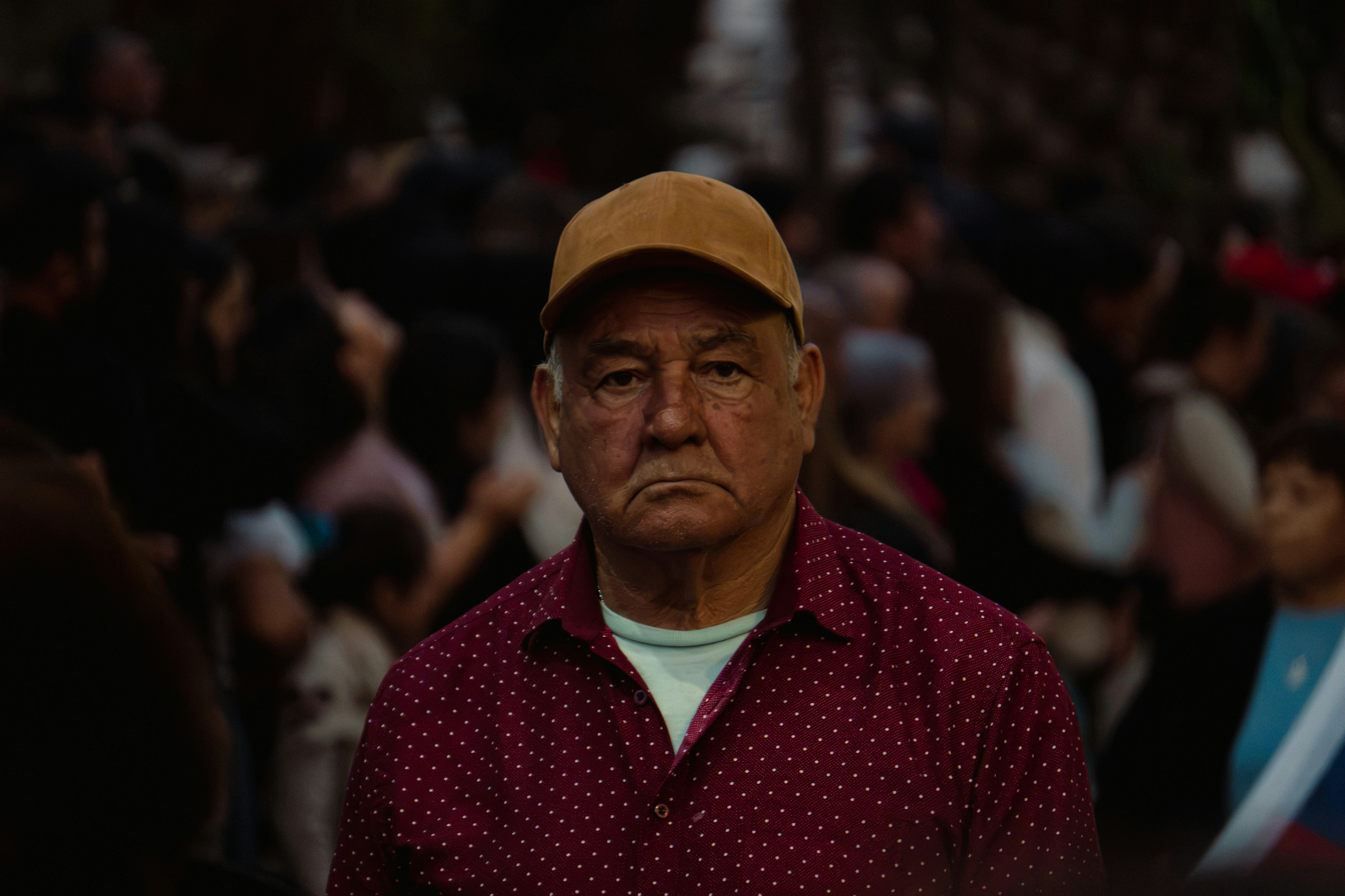 Centered Elder in a Sea of Faces