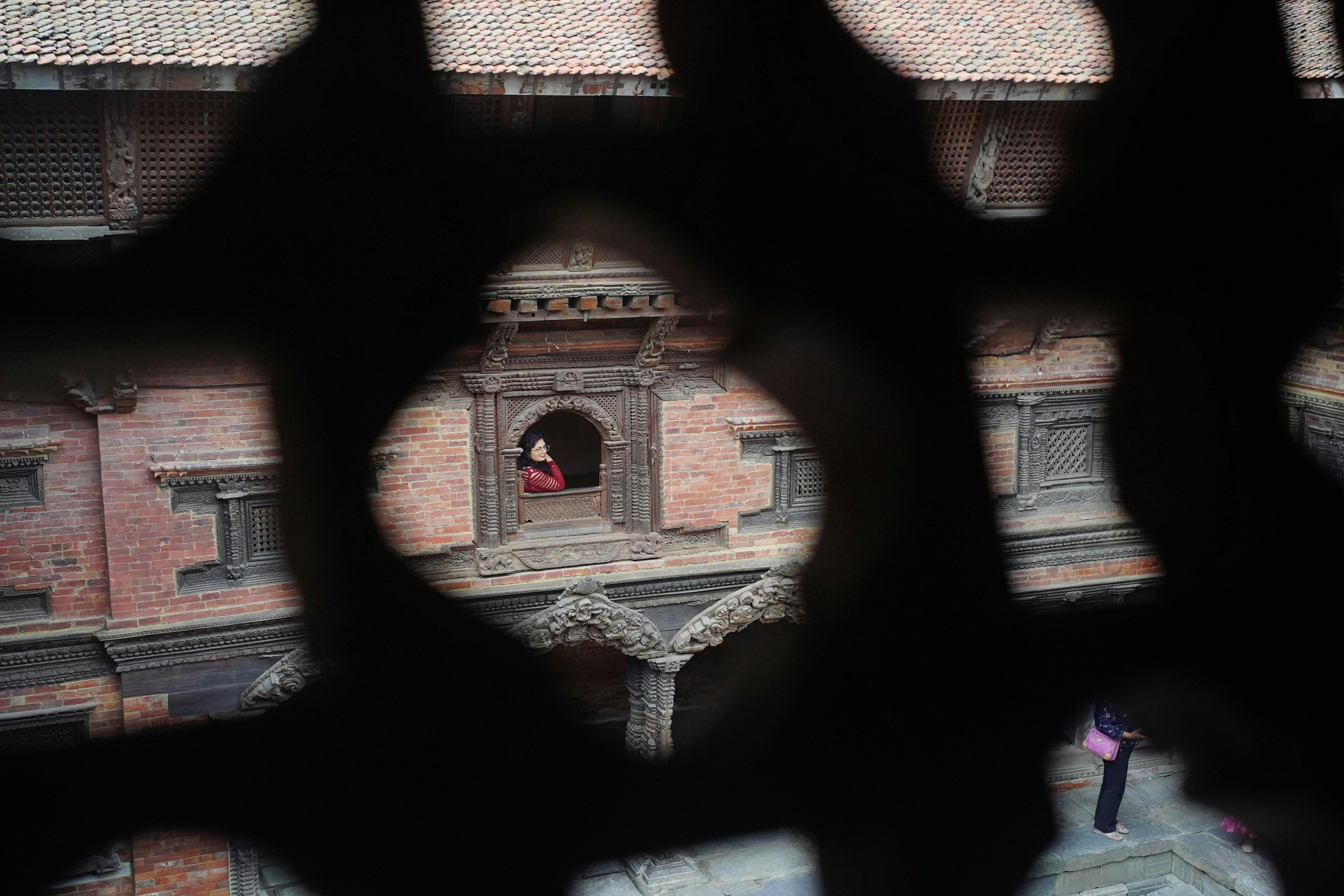 Hidden Courtyard Gaze: A Portrait Through the Lattice