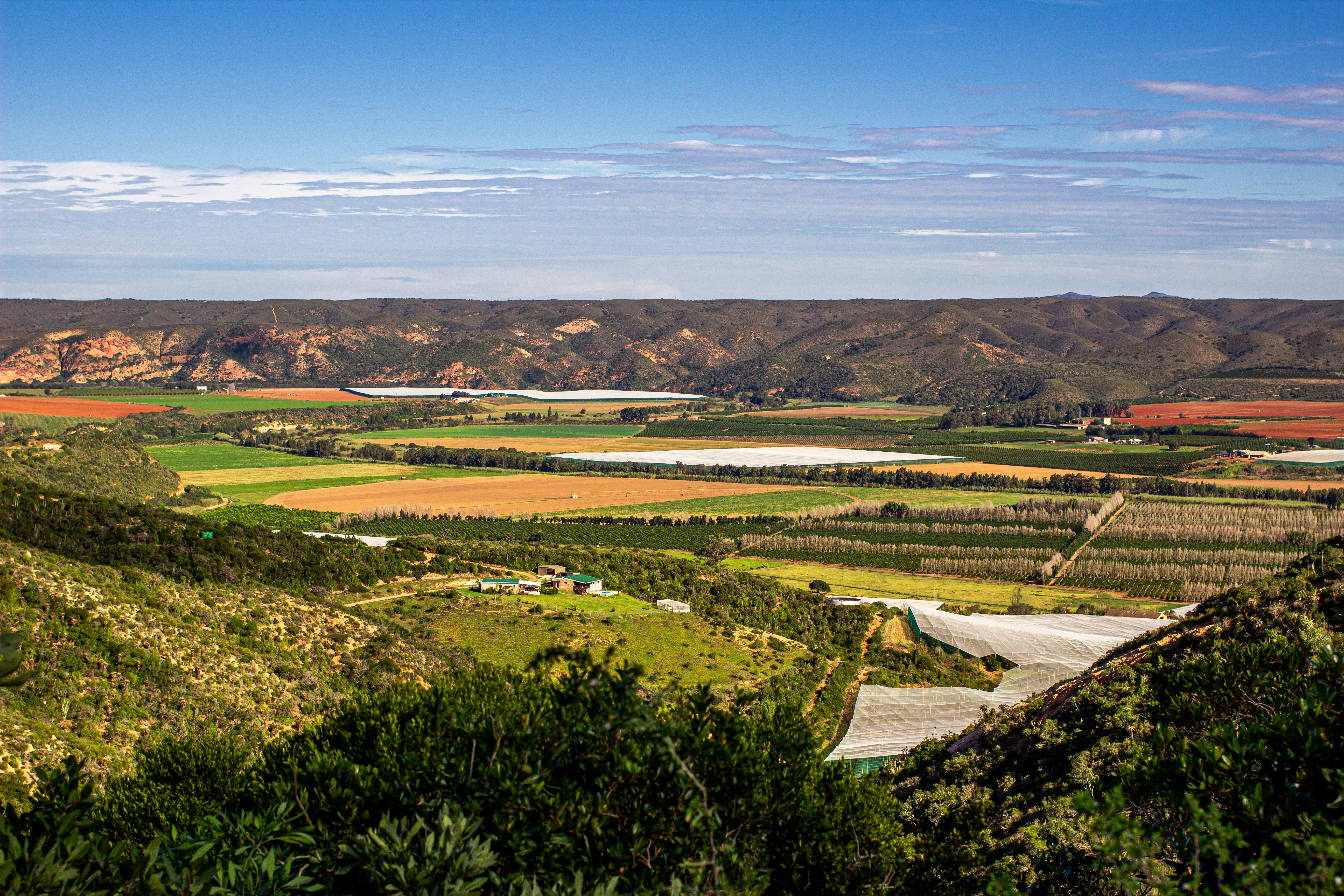 Sunlit Valleys Unfold Behind a Tiled Terrain