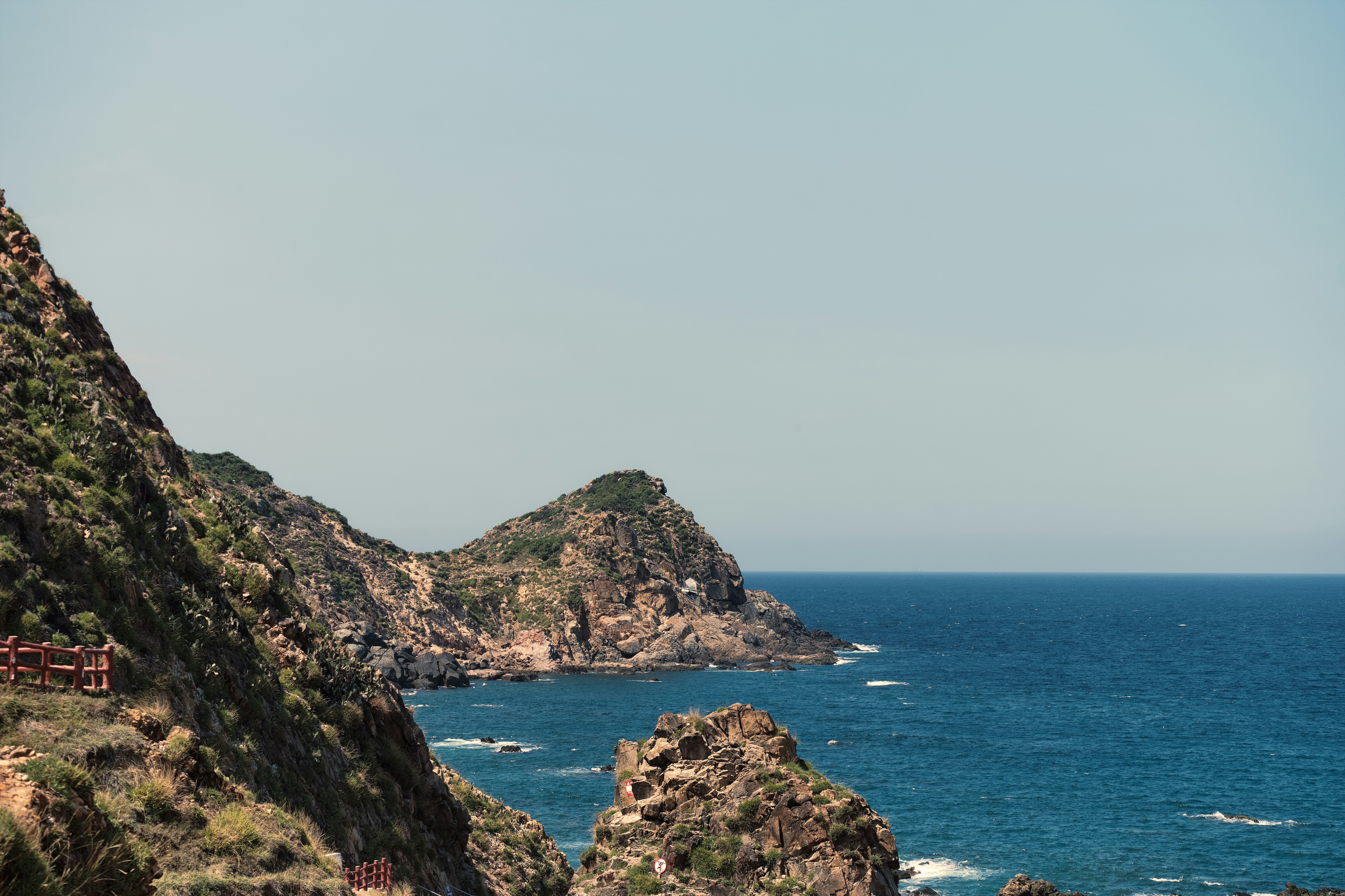 Cliffside Coastline under a Clear Horizon