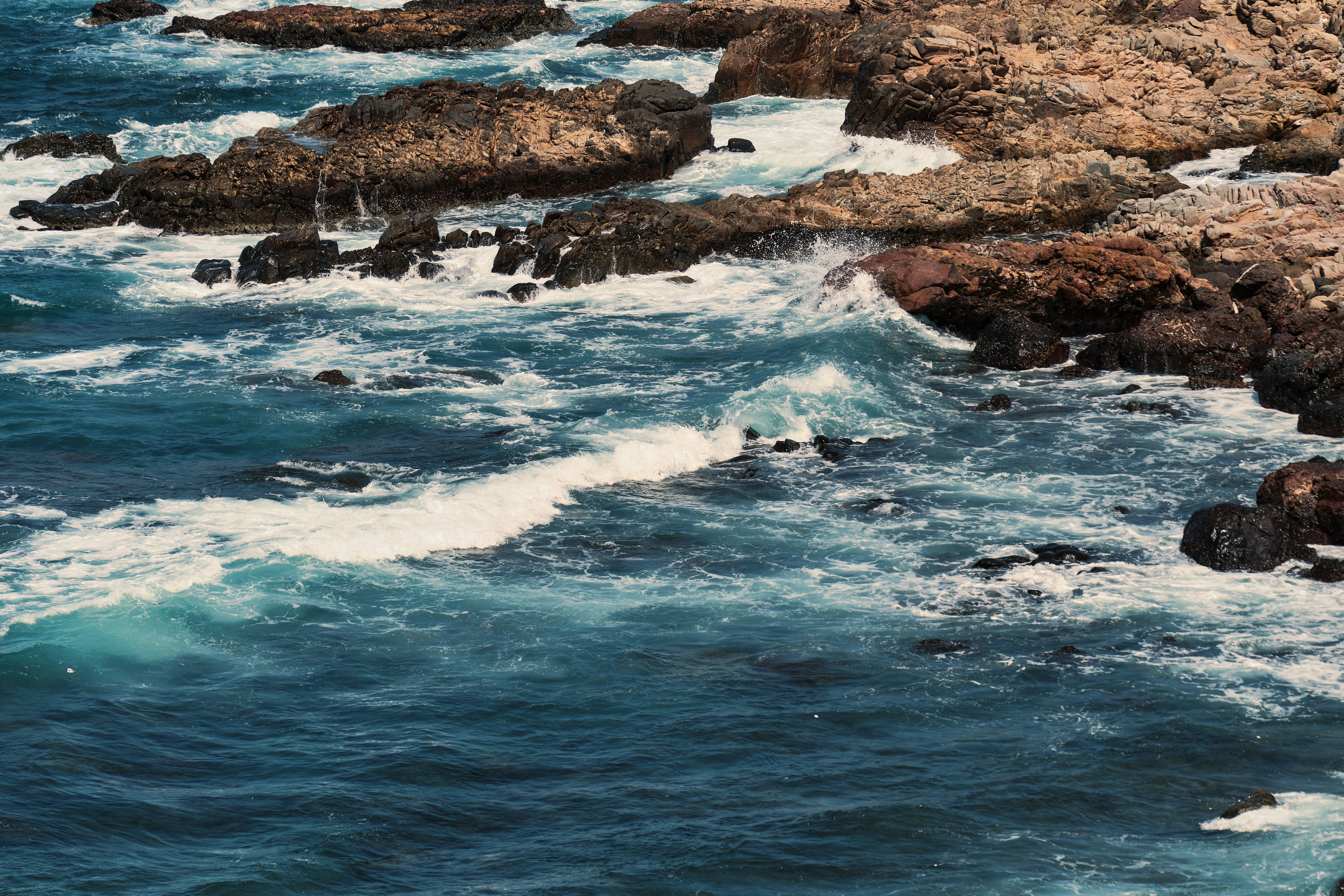 Foam and Stone: A Seaside Jumble of Tide and Tectonics