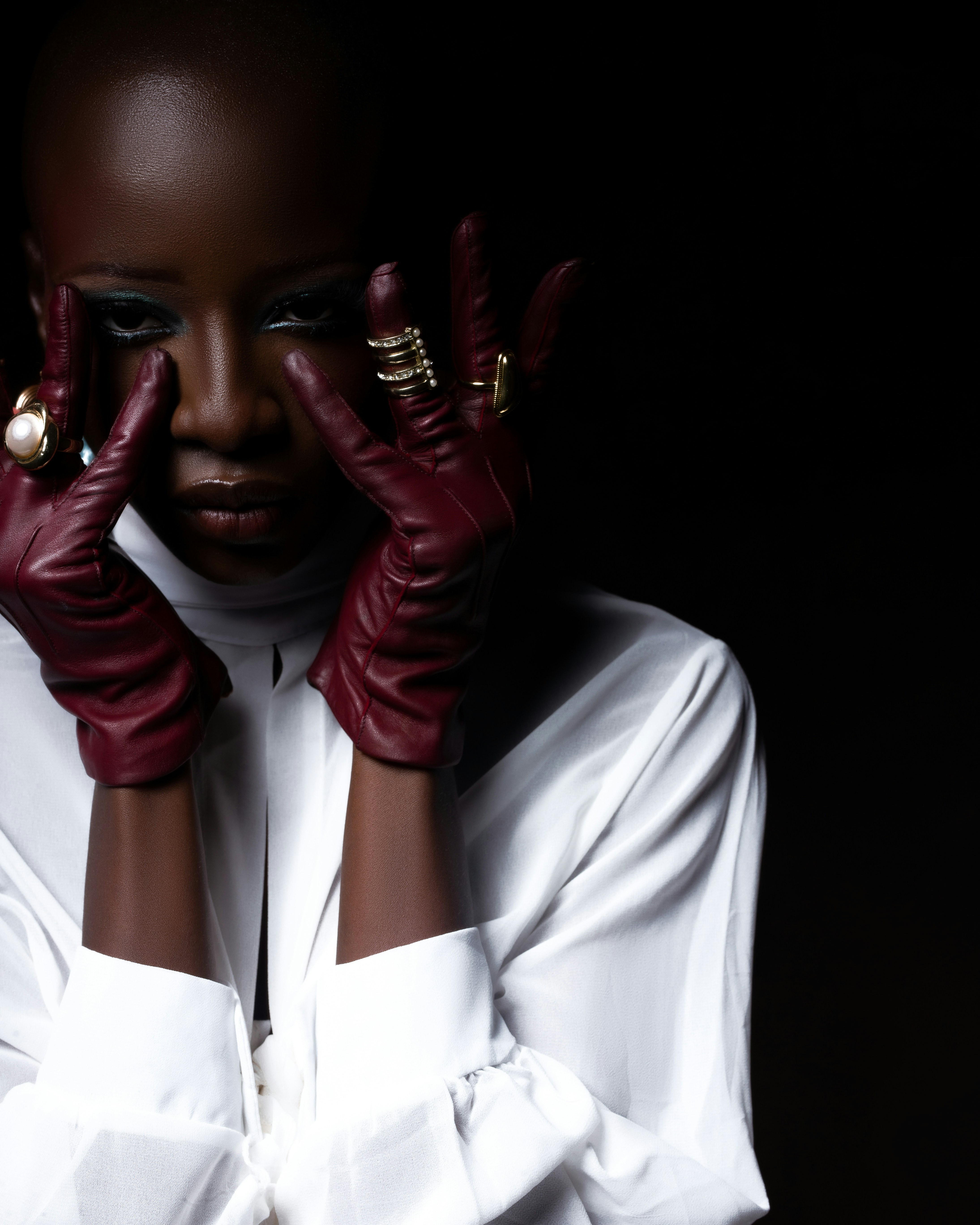 Midnight Velvet: A Close-Up of Hands and Gown in Shadow