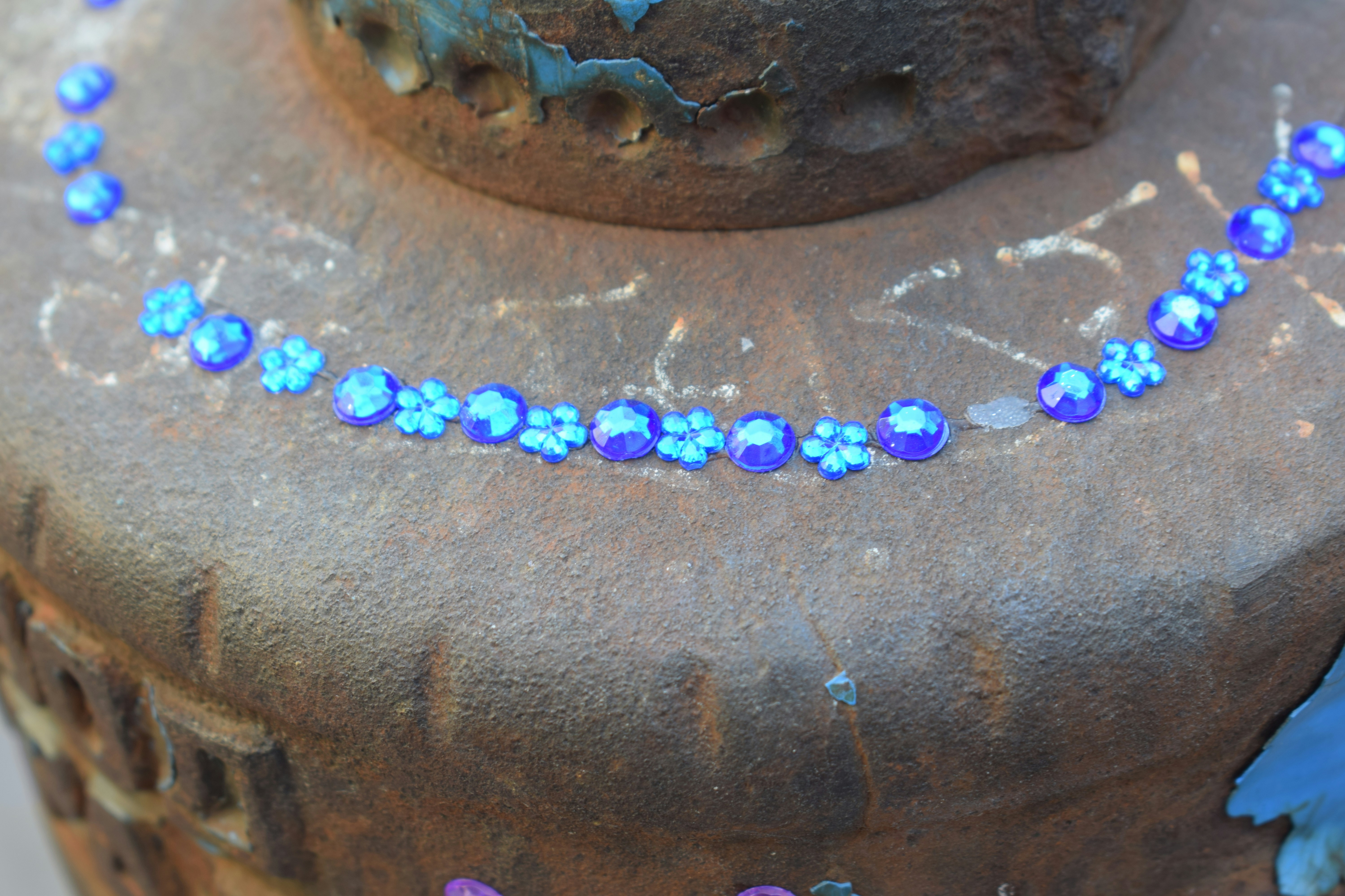 Blue Gemline on Rusted Vessel: A Quiet Portrait of Decay