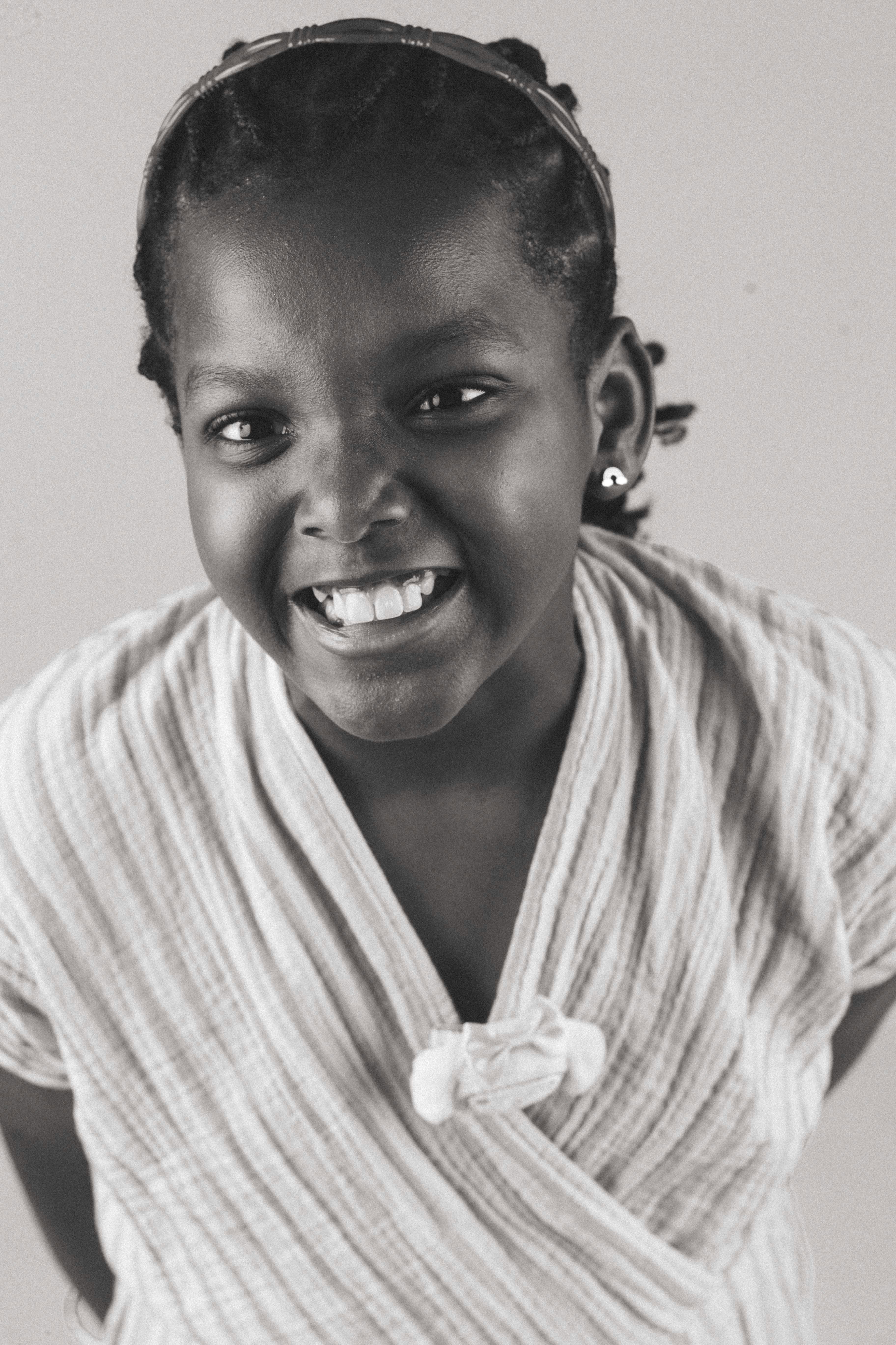 Joyful Portrait: A Bright Smile in Soft Monochrome