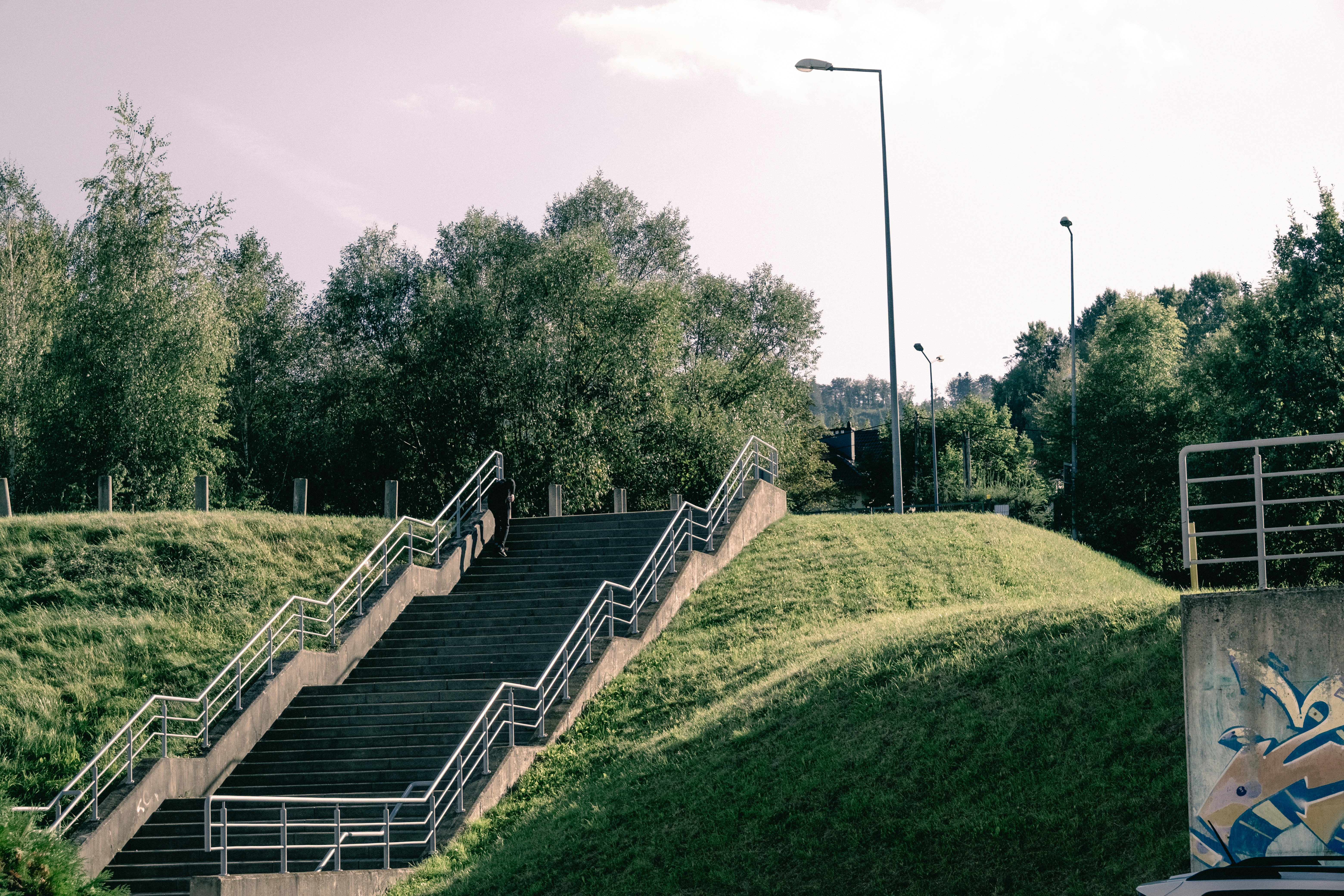 Staircase Through Sunlit Riverside Park