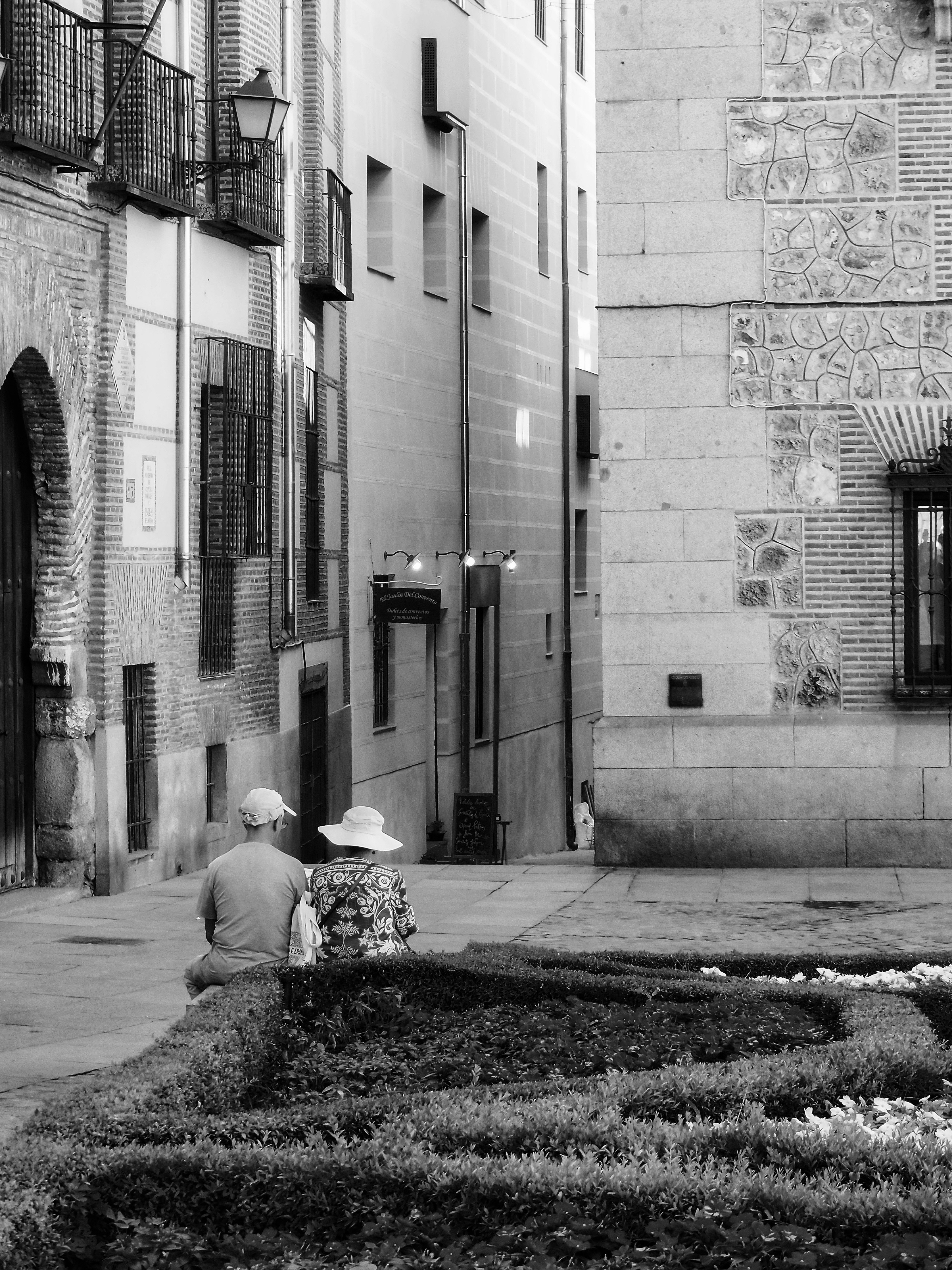Quiet Return: Two Figures in a Narrow Urban Quiet