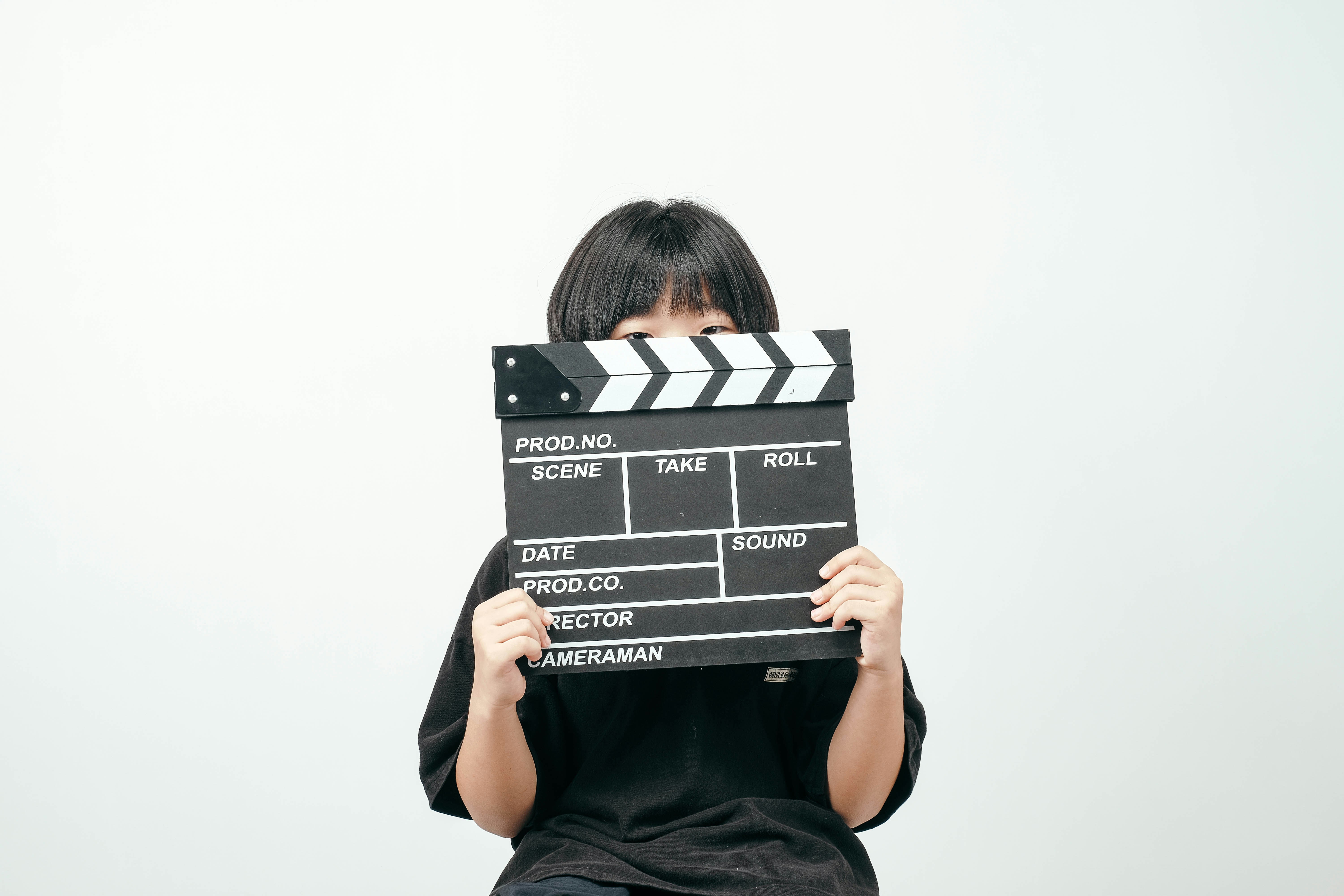 Holding Silence: A Clapperboard Conceals a Subtle Portrait