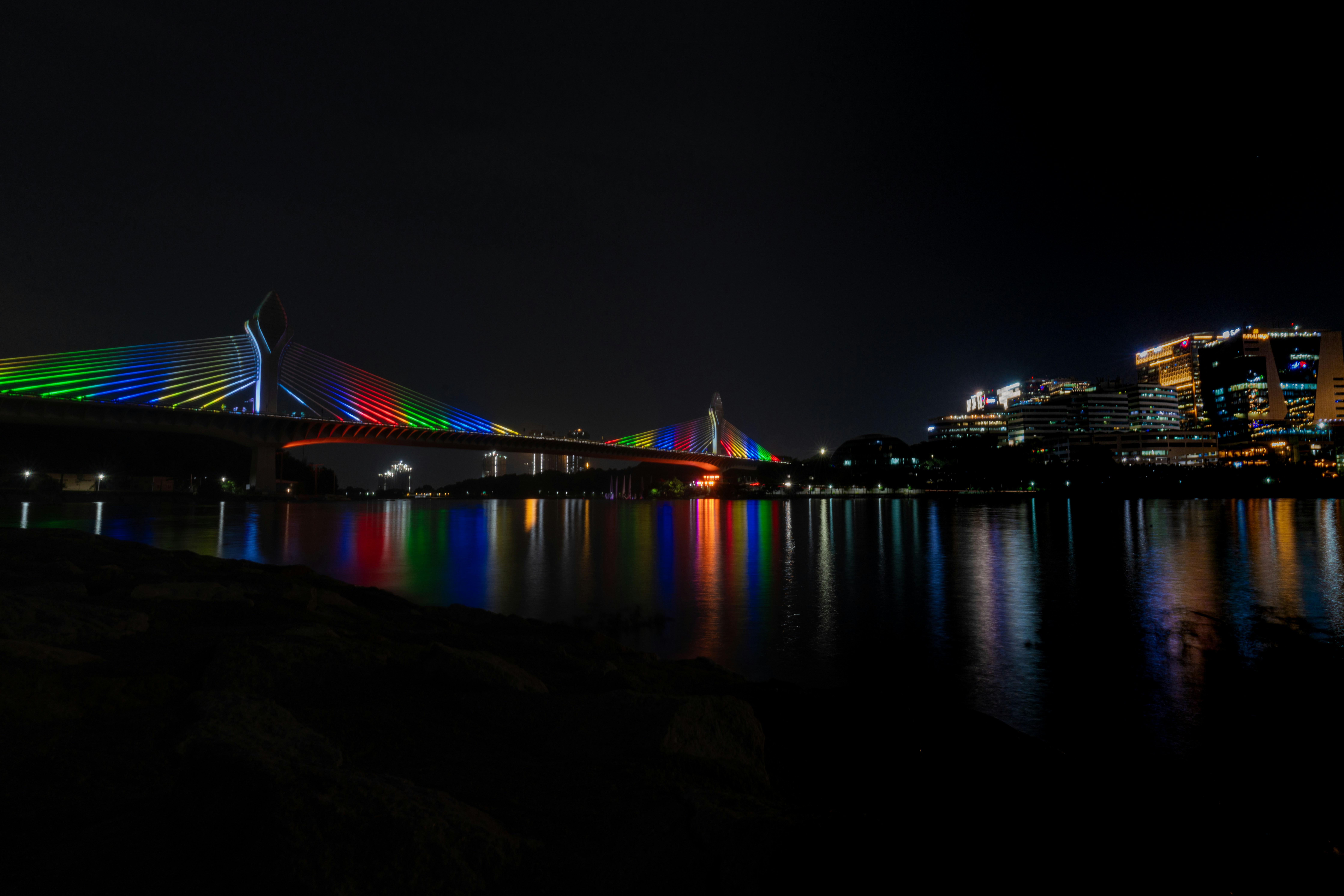 Rainbow Bridge in Night Lights: Reflections over the River