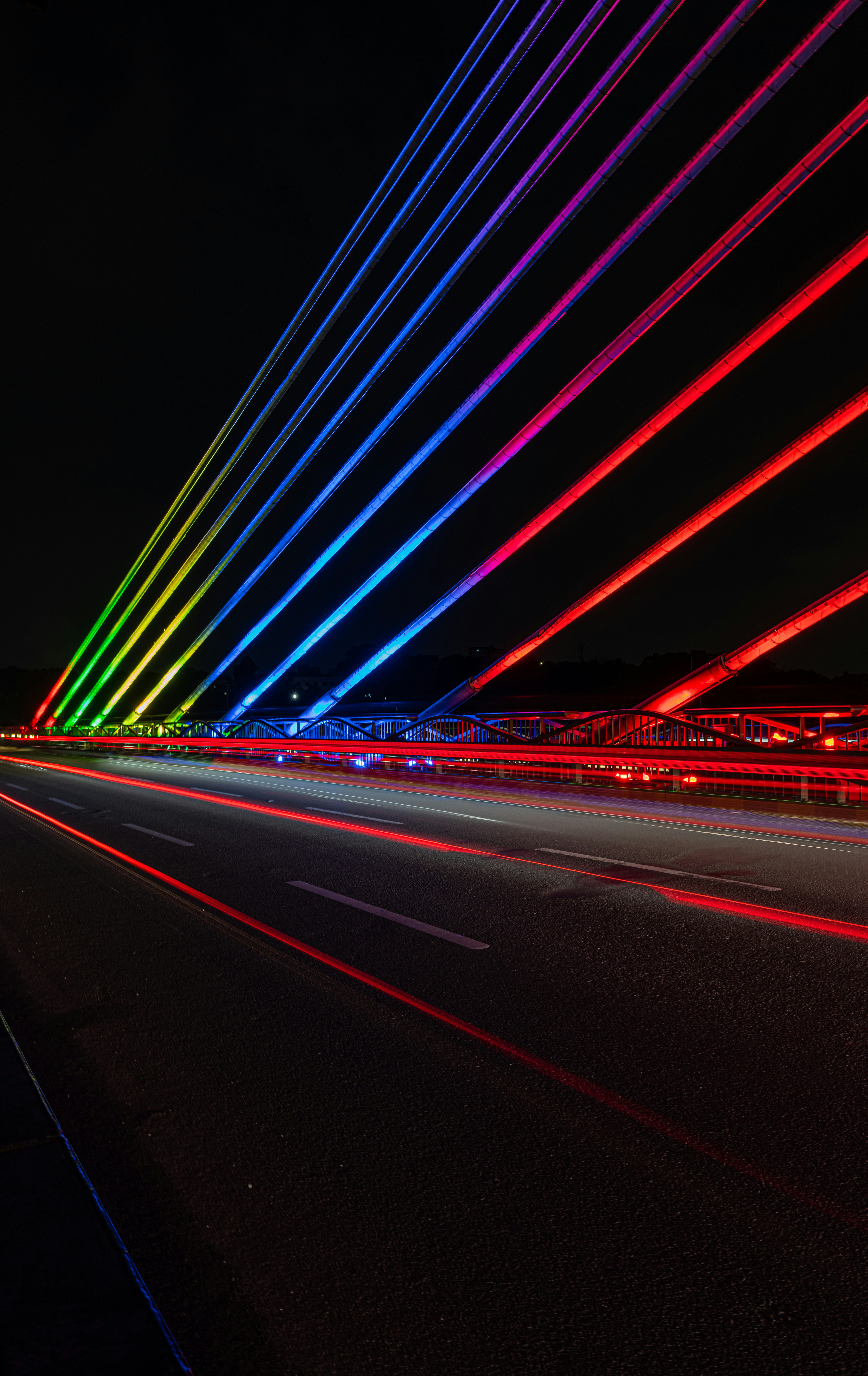 Neon Arcs Over a Night Road