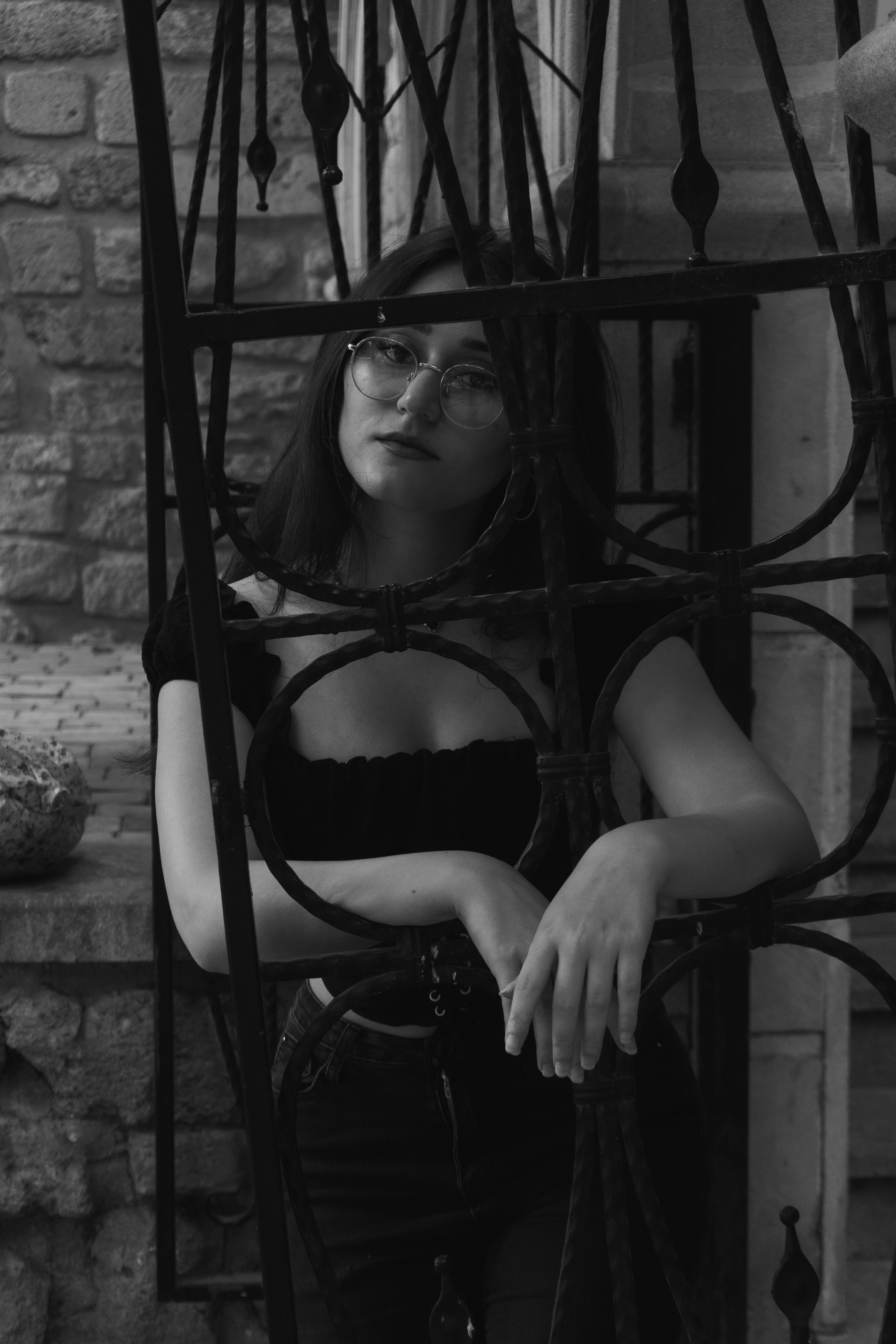 Veiled in Iron: A Portrait Through Barred Framing