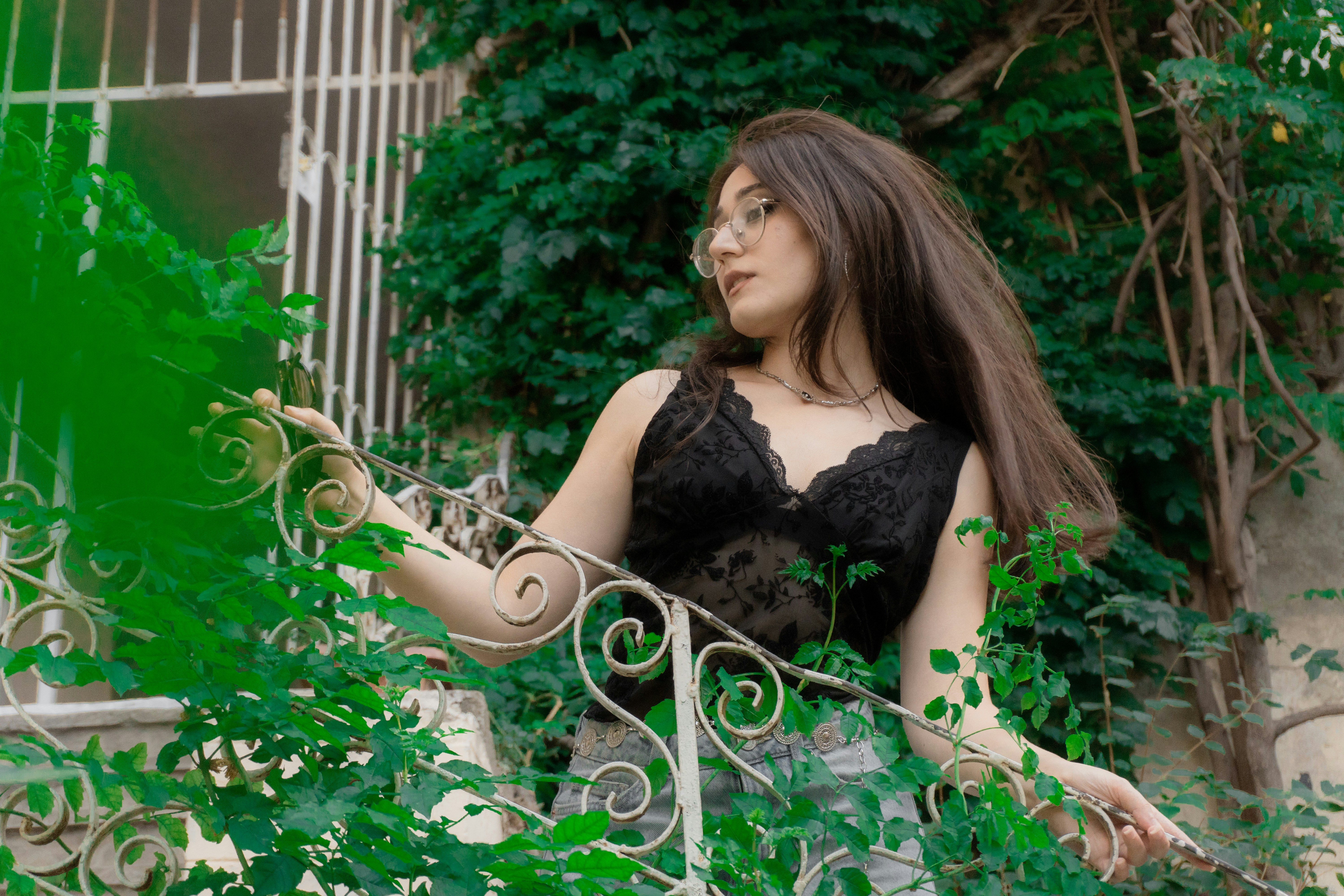 Veiled Grace on the Ironwork Balcony
