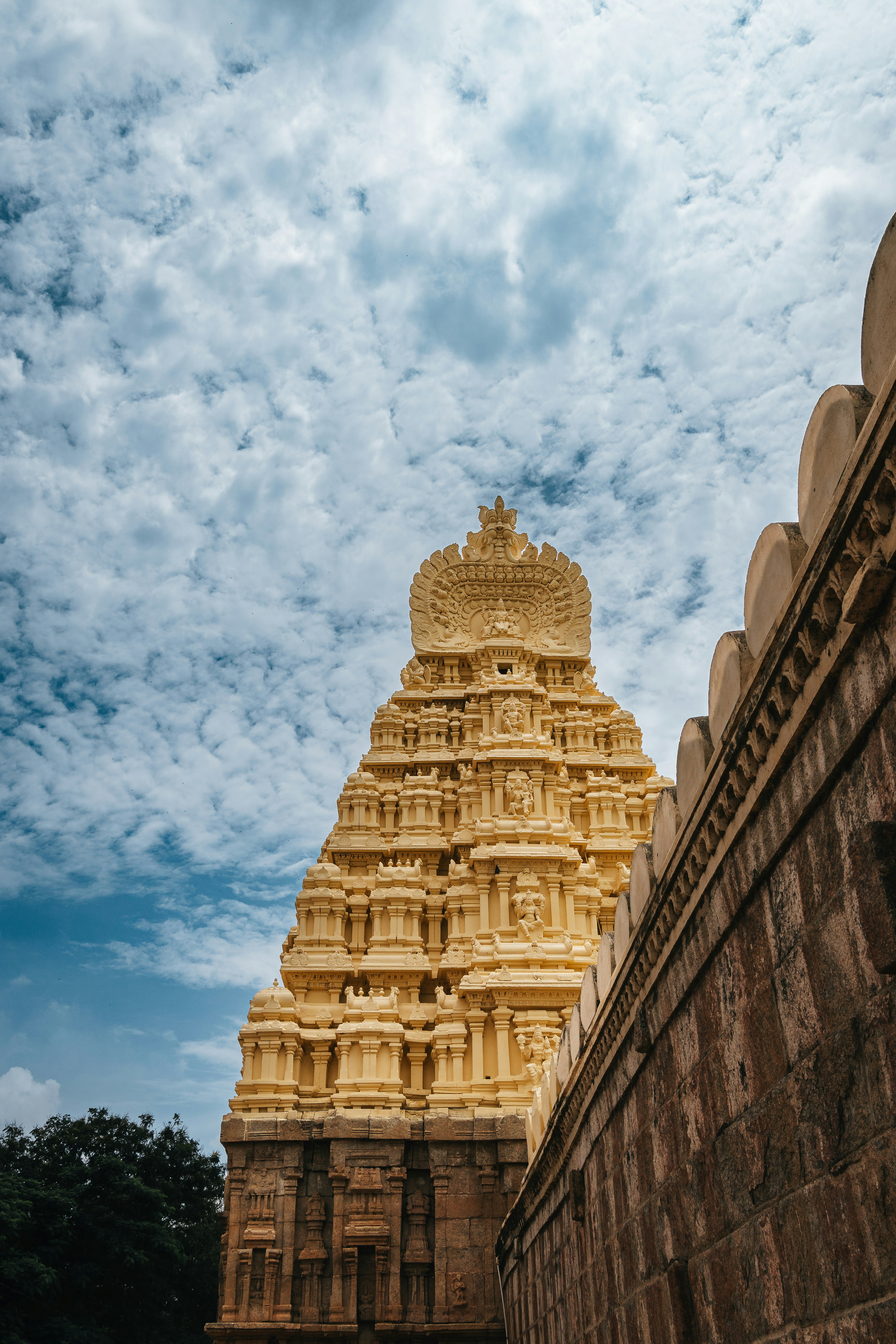 Amber-topped Sacred Tower Rising Above Sanstone Walls