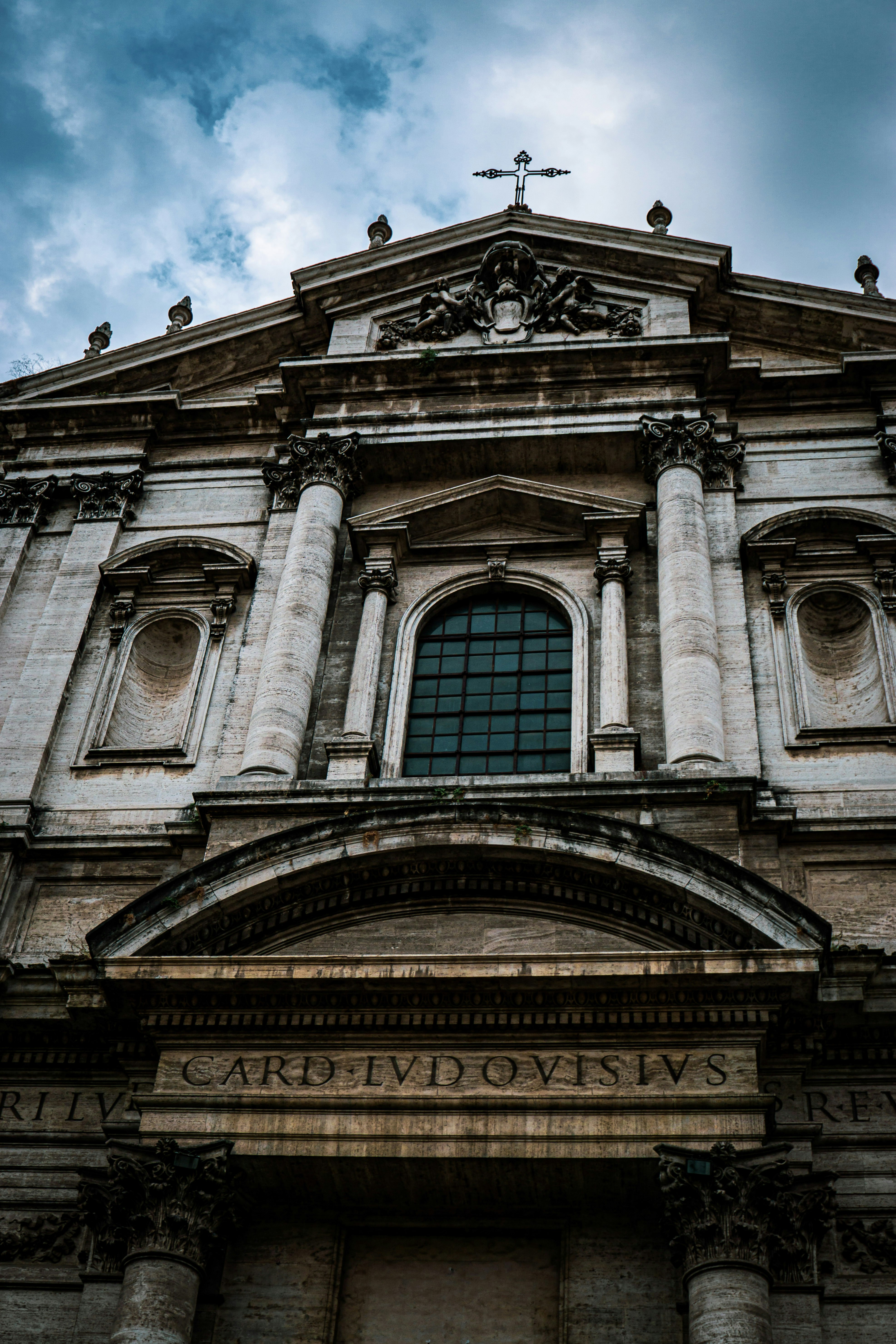 Stone Cathedral Facade: A Monumental Symmetry Under a Stormy Sky