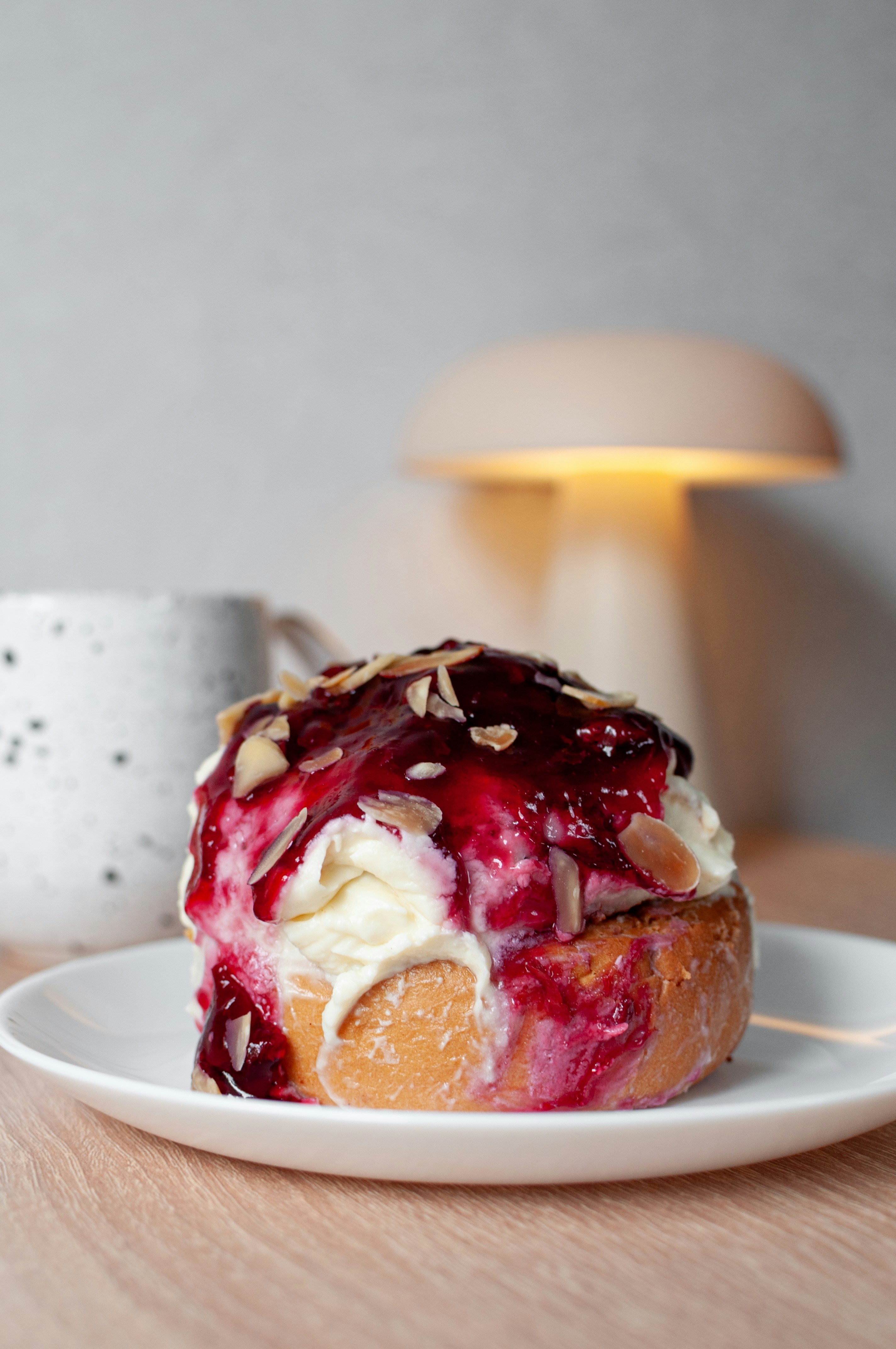 Crème Brûlée Sunrise: A Glazed Doughnut Under a Berry Splash