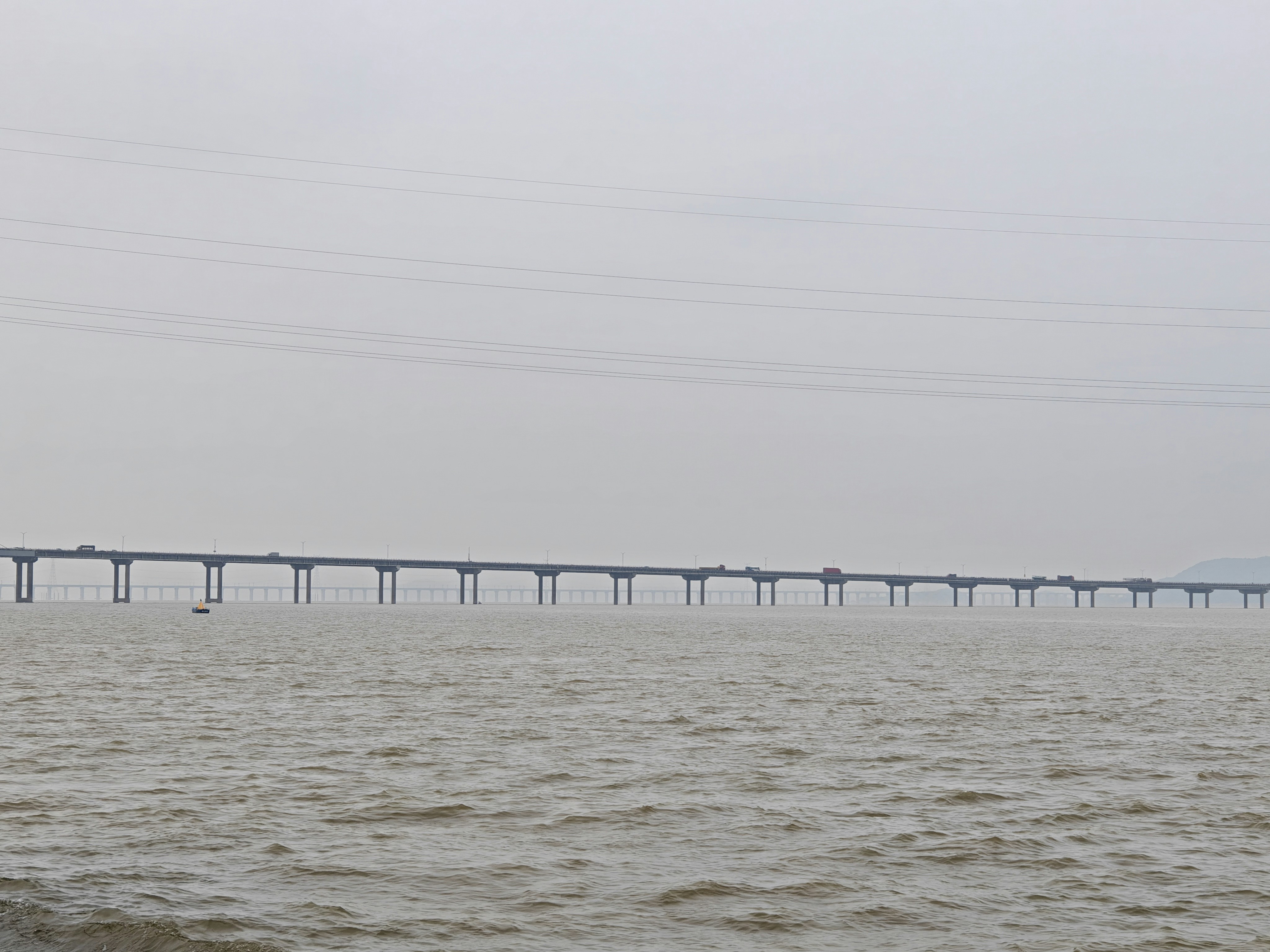 Low Horizon, Endless Span: The Rainy Day Bridge Over Water