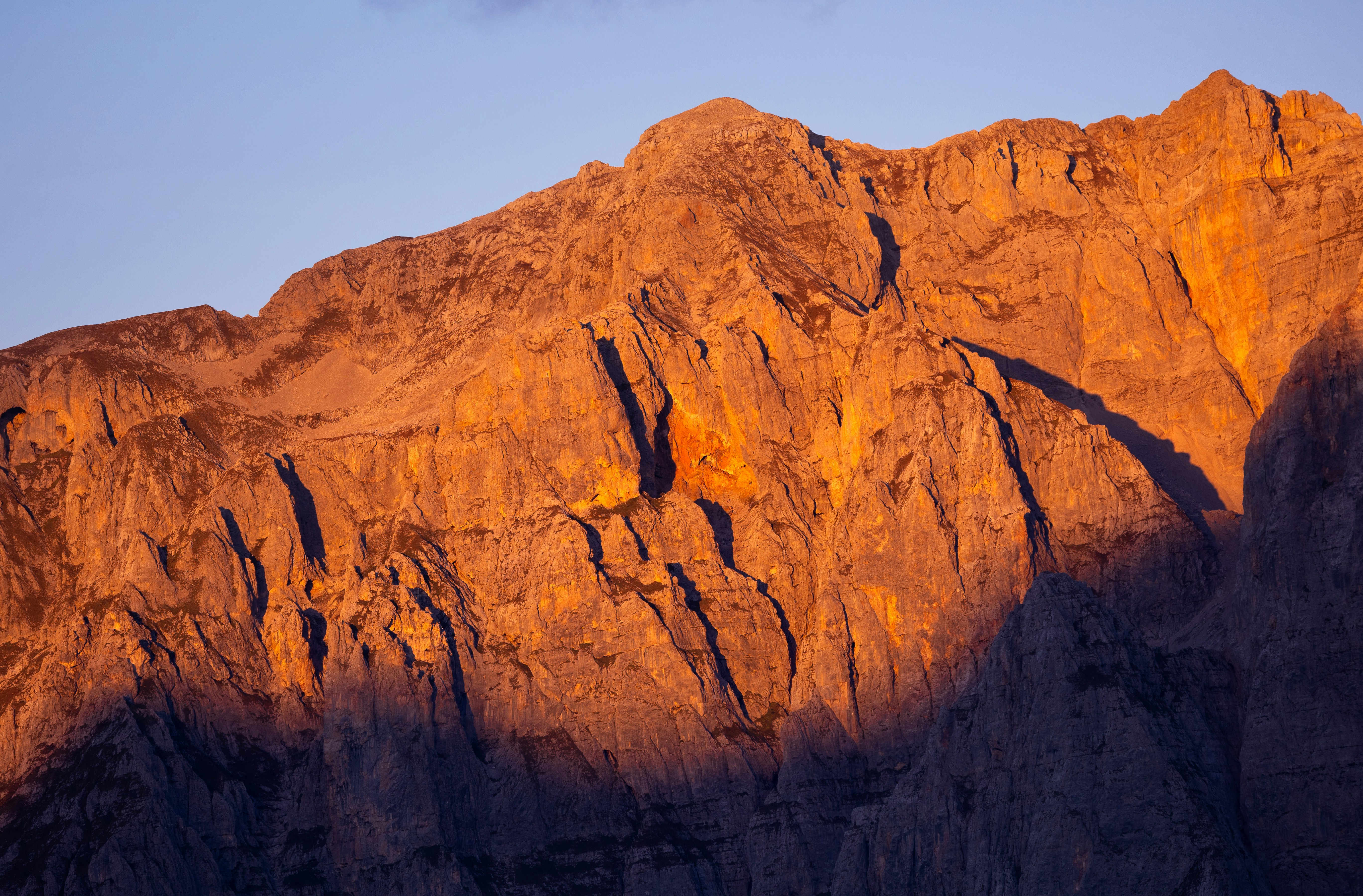 Golden Ridge: Sunset Light on Rugged Cliffs