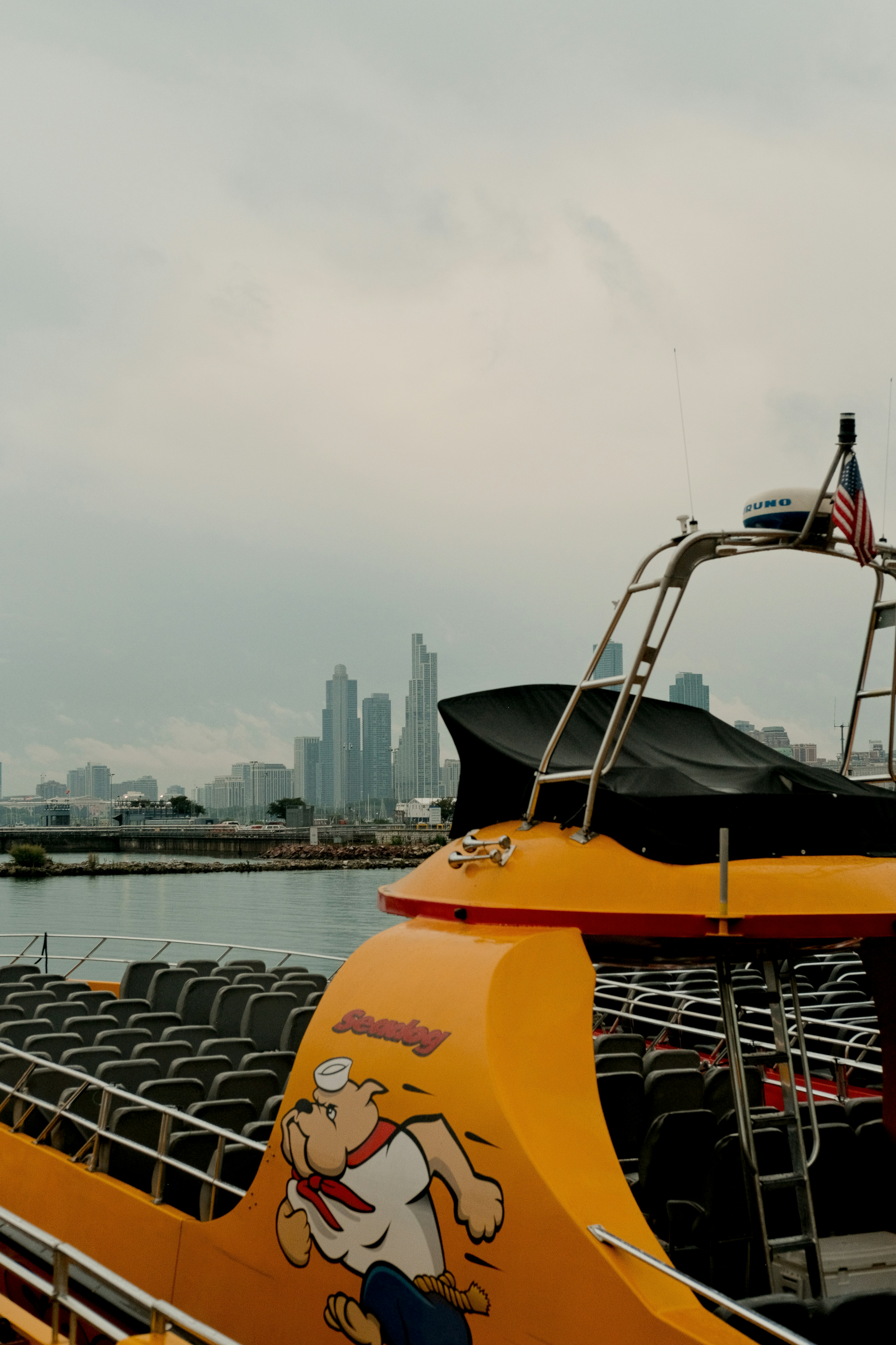  Lifeboat in the Spotlight: Orange Tender with Cityscape Backdrop