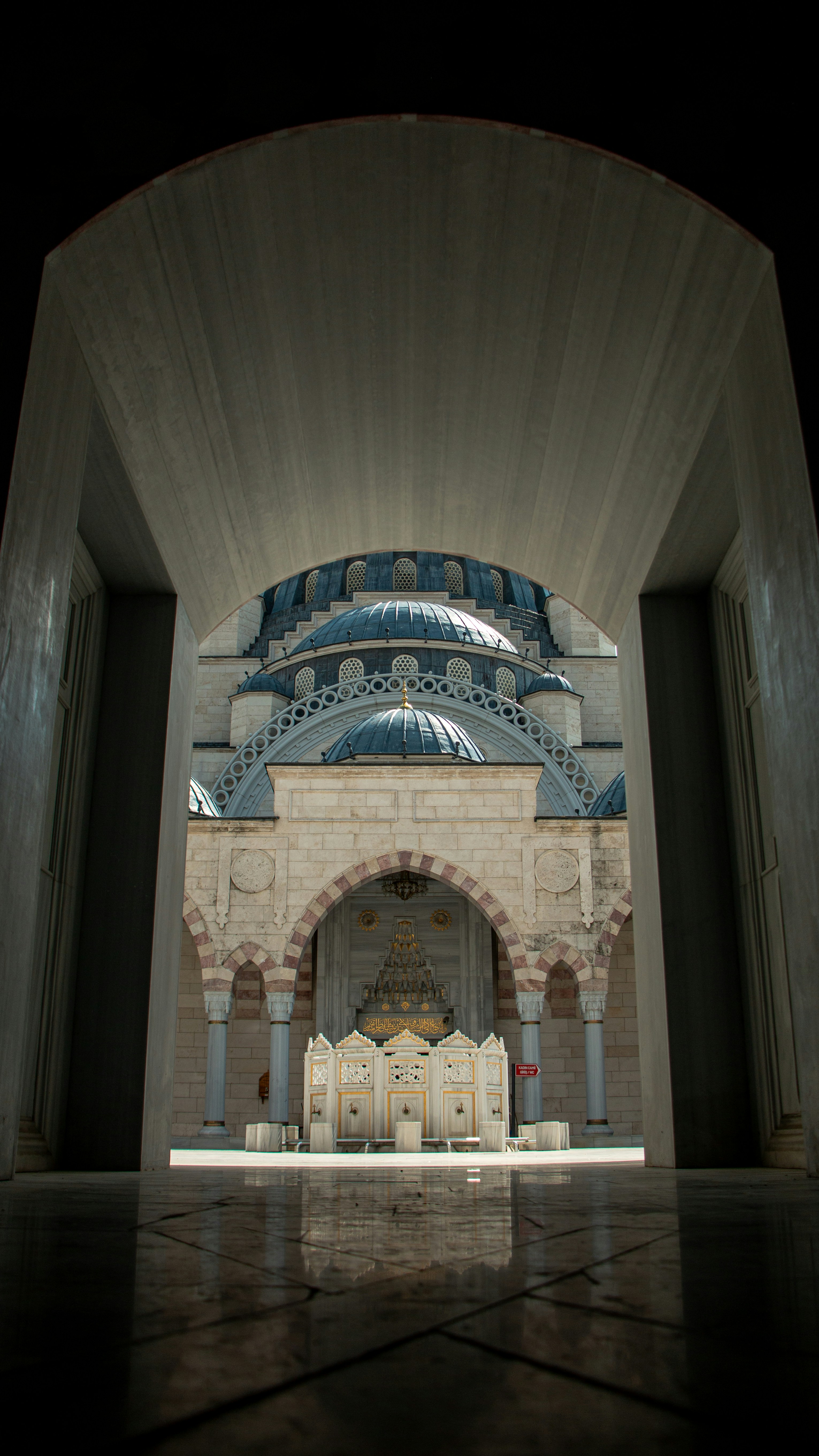 Archway to Illumination: Temple Interior Framed by Monolithic Pillars