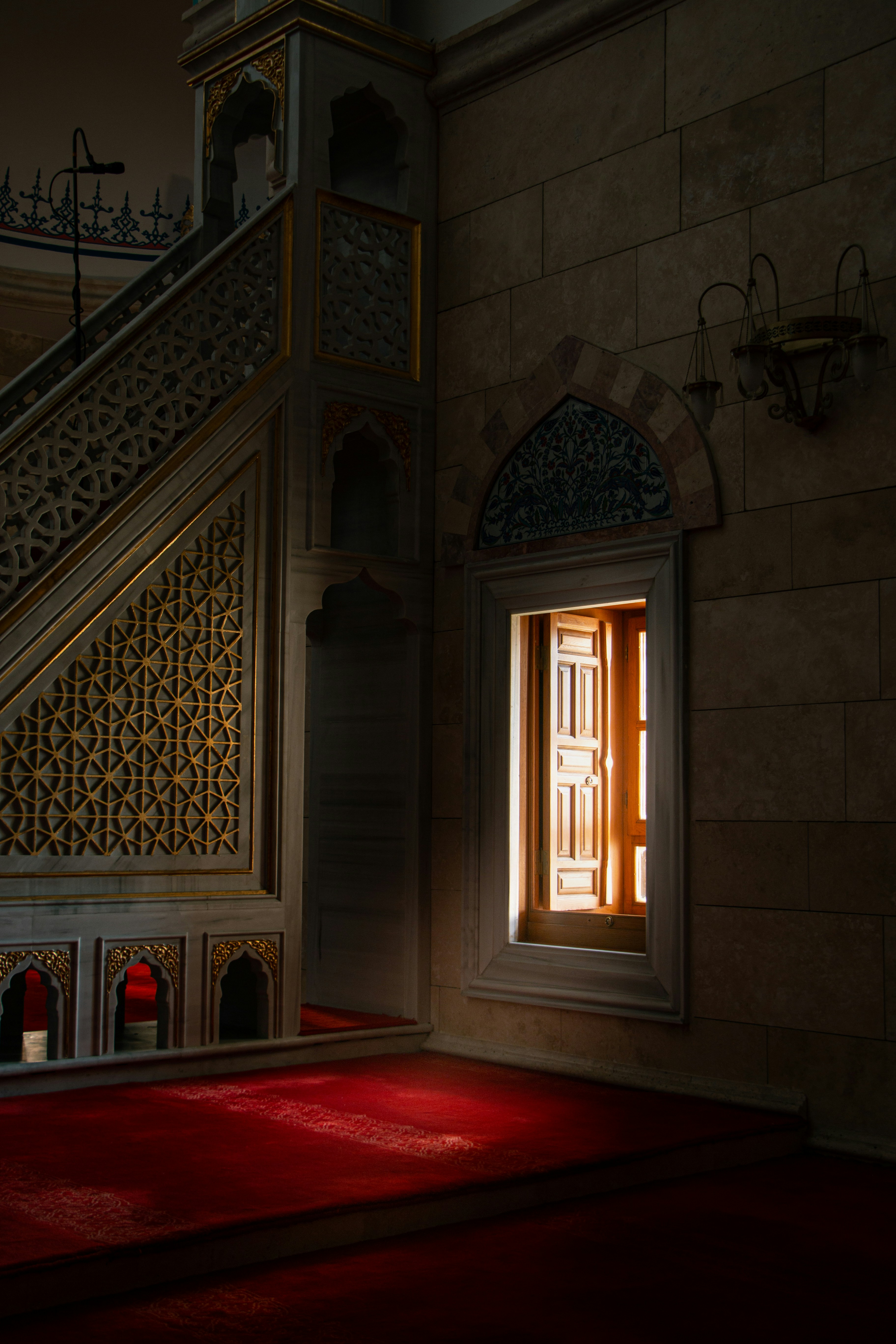 Sunlit Mooring Through a Carved Window in Silent Marble