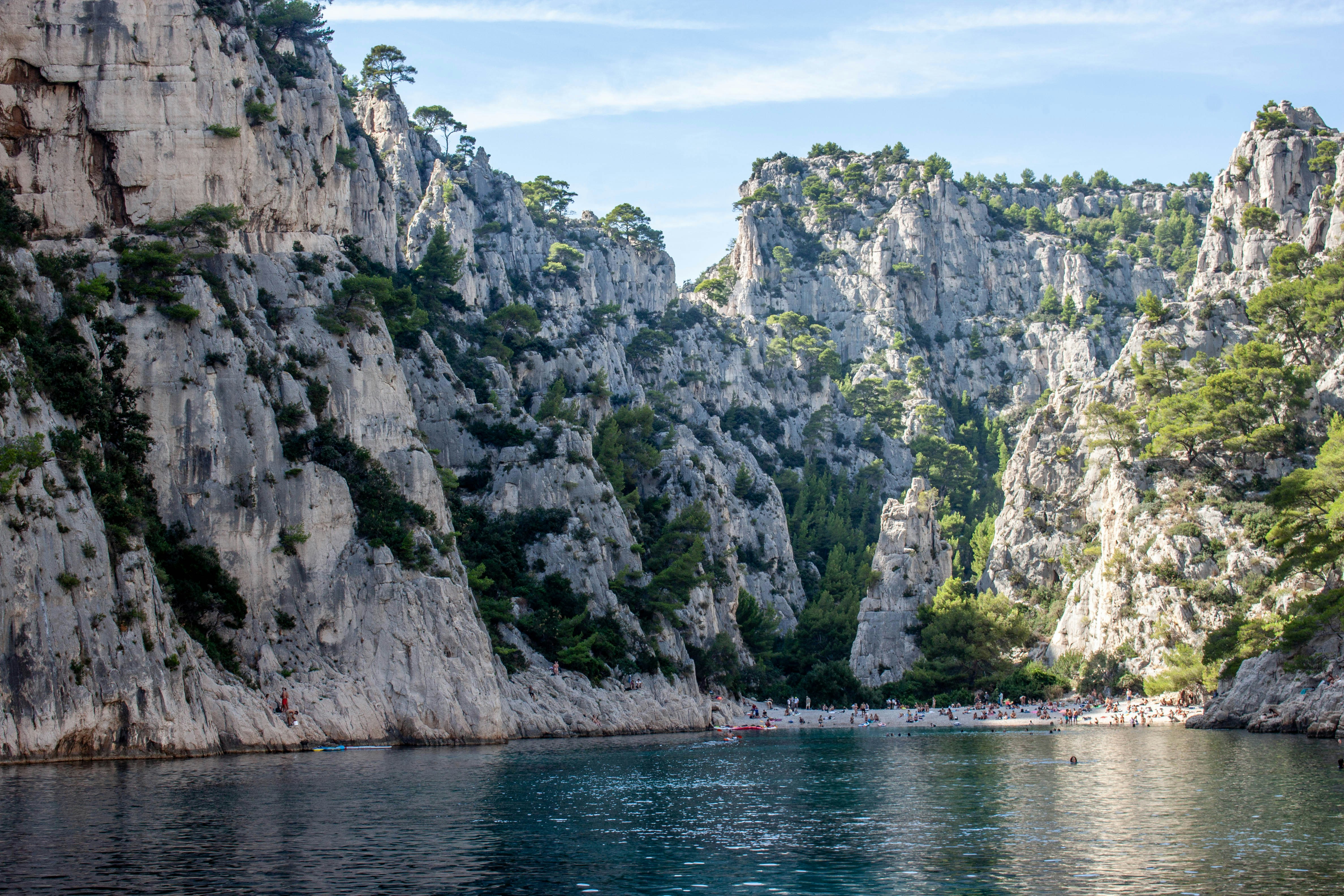 Cliffside Rendezvous: A Narrow Cove Between Sunlit Peaks