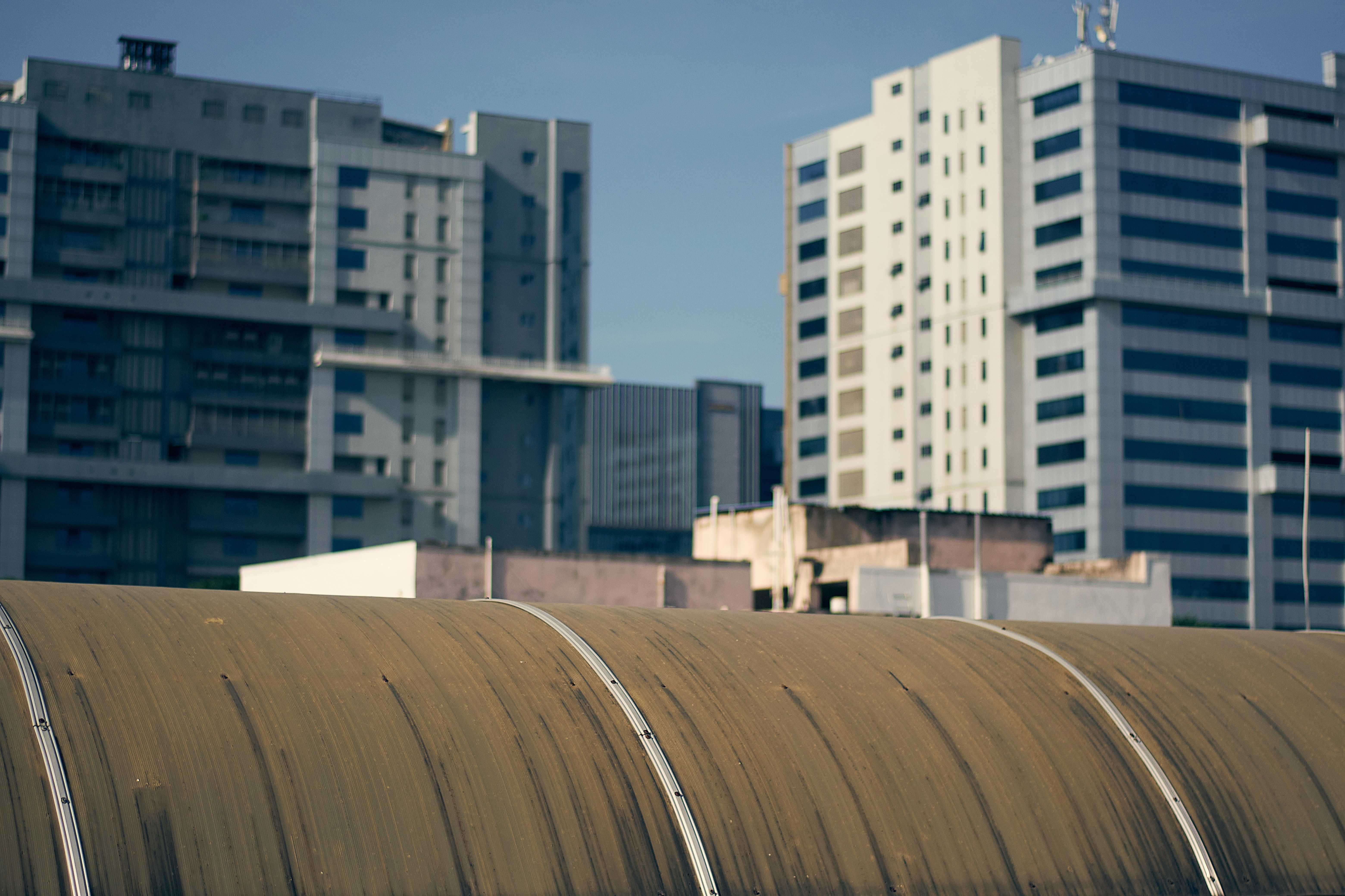 Urban Veil: Cylindrical Rooftop Tubes Meet Skyward Towers