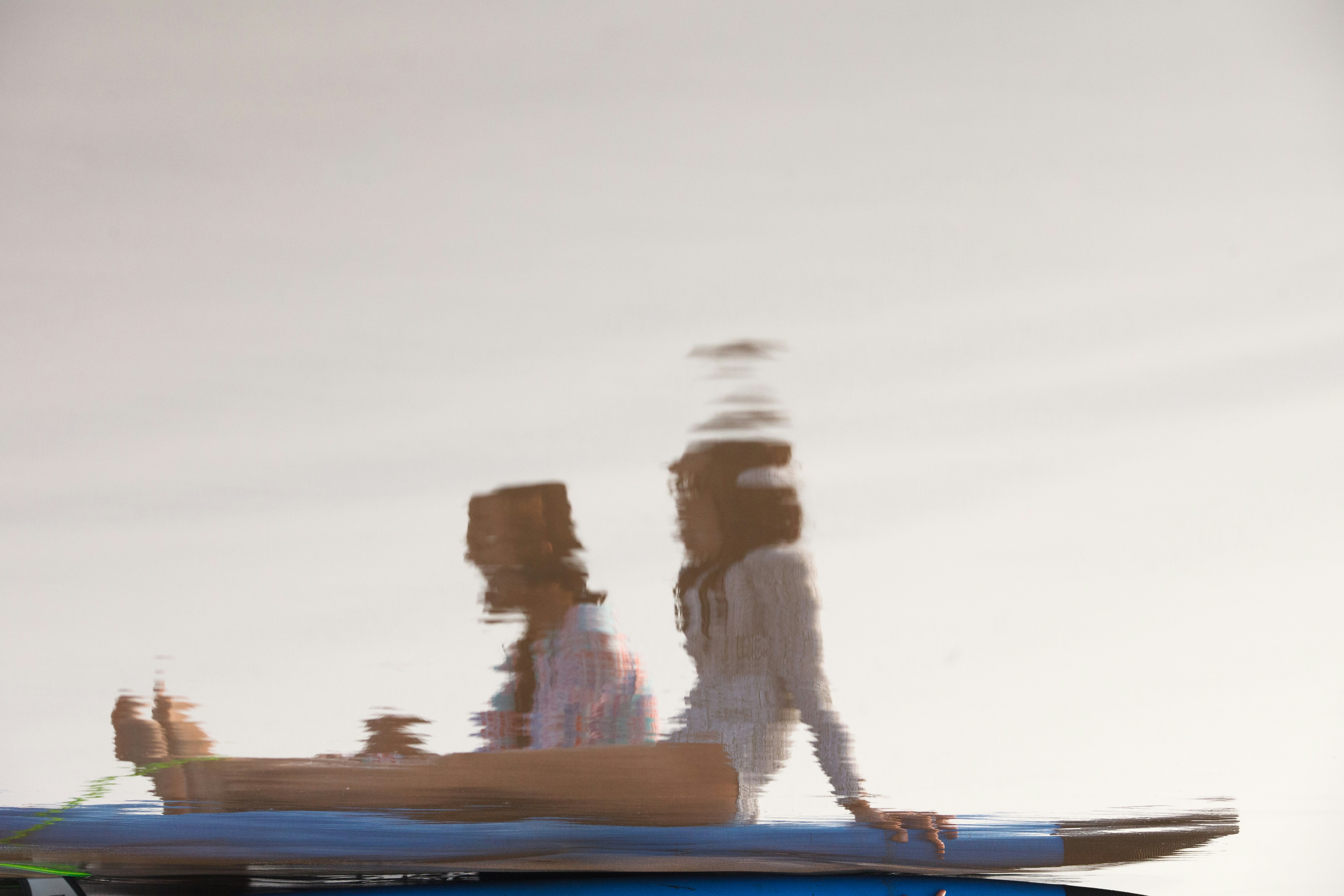 Paddleboarders in a Gliding Moment