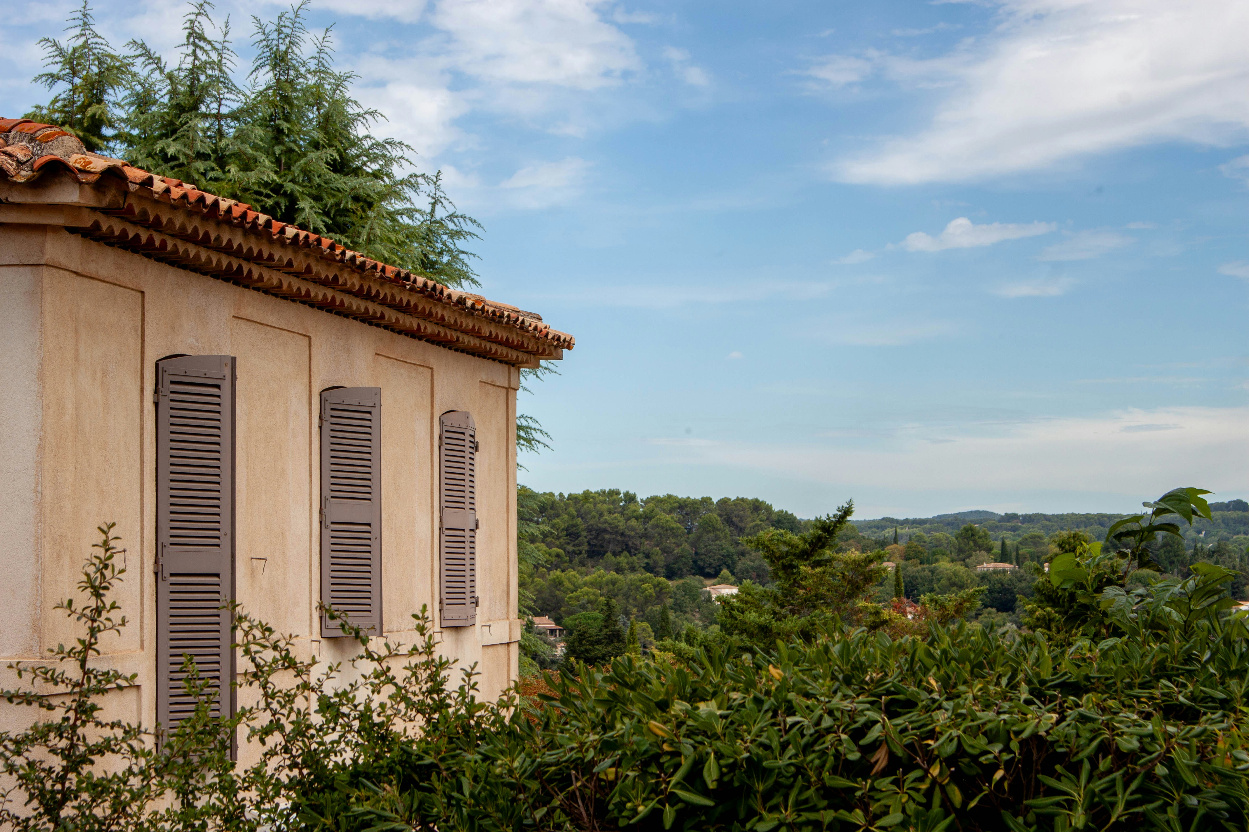 Terracotta Rooflines and Quiet Garden Veil