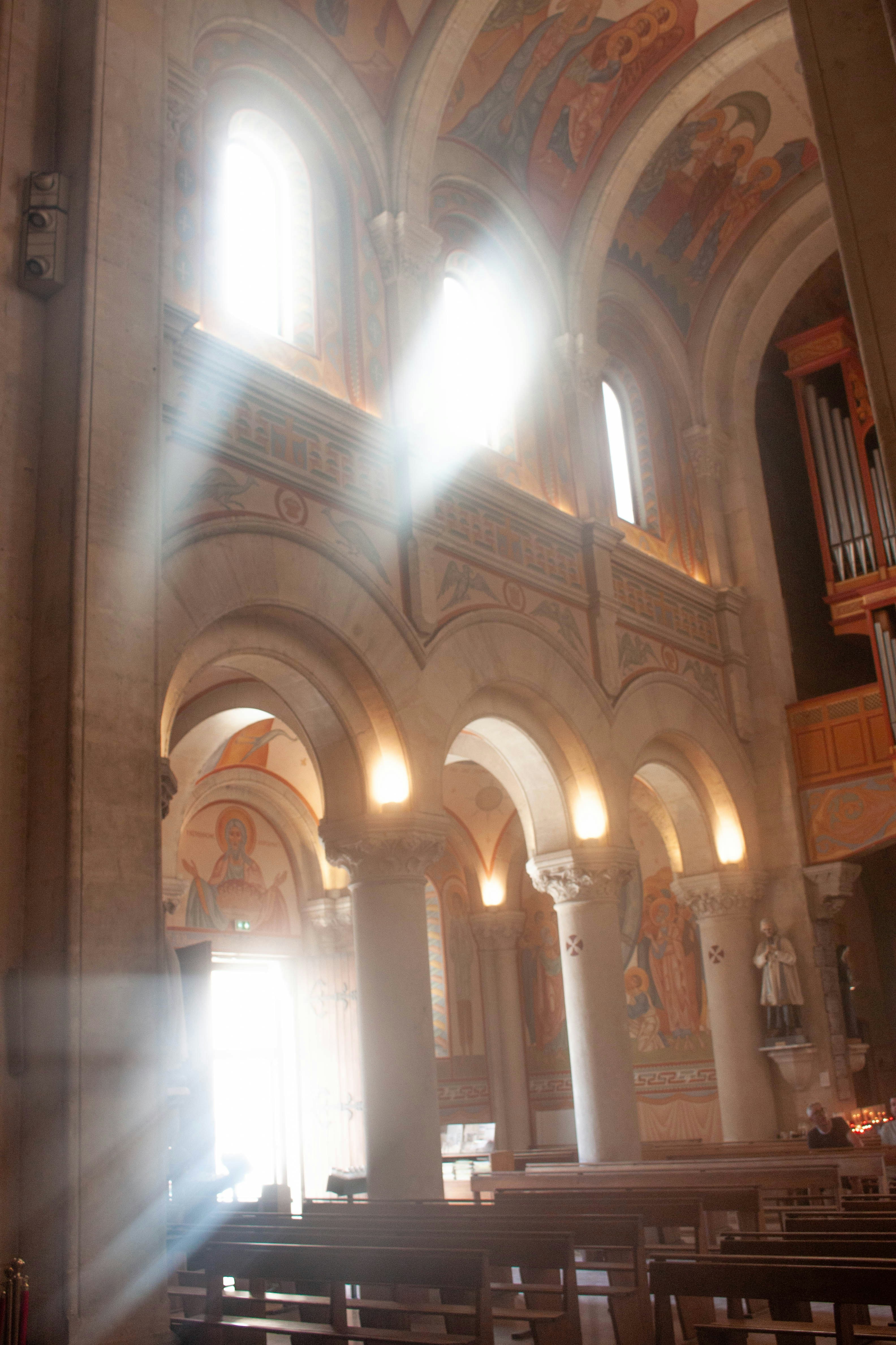 Sunlit Choir in a Cathedral: Beams Through Archways