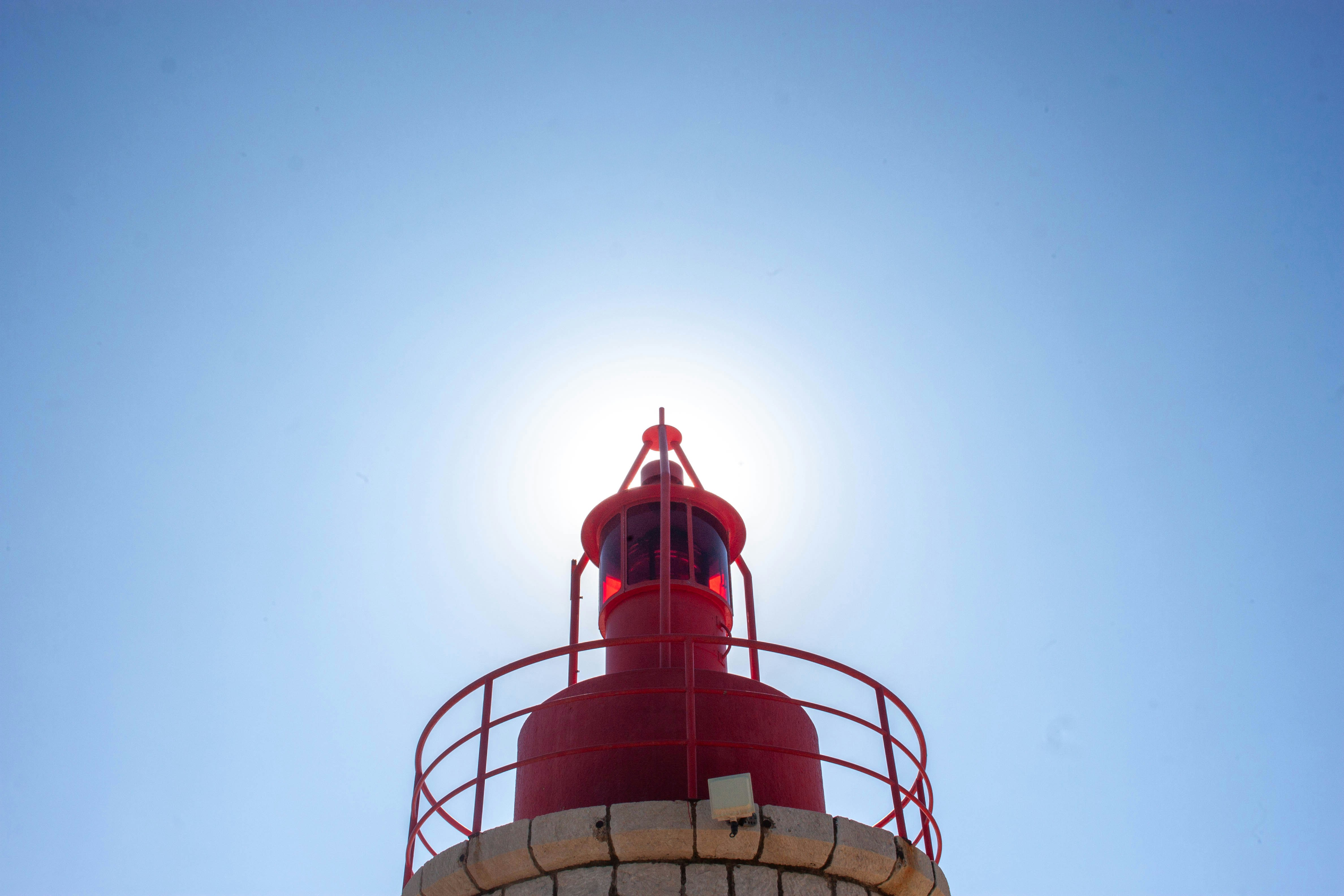 Halo over the Red Beacon: Lighthouse Peak Against a Clear Sky