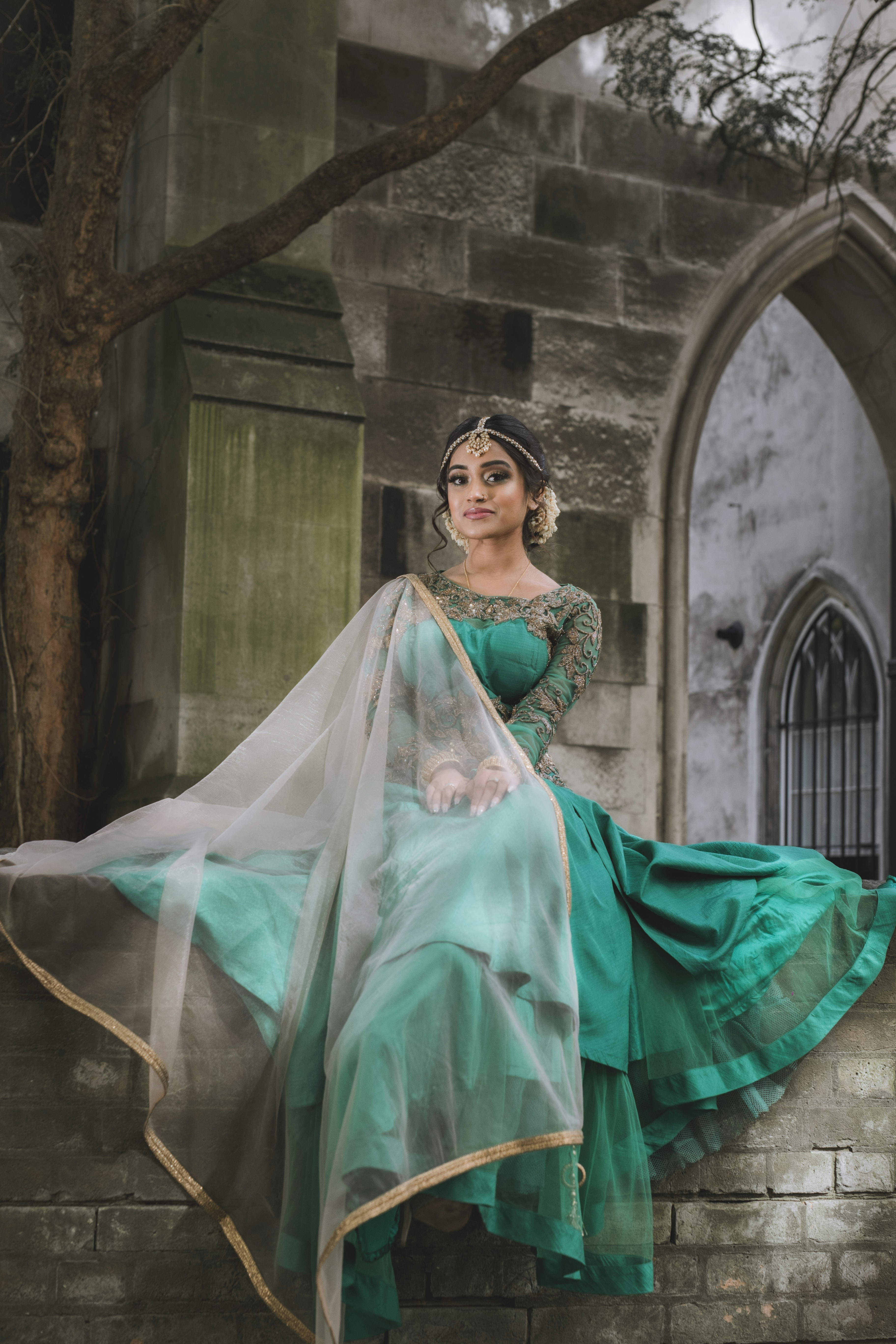 Emerald Elegance on Stone: Grace Amid Gothic Arches