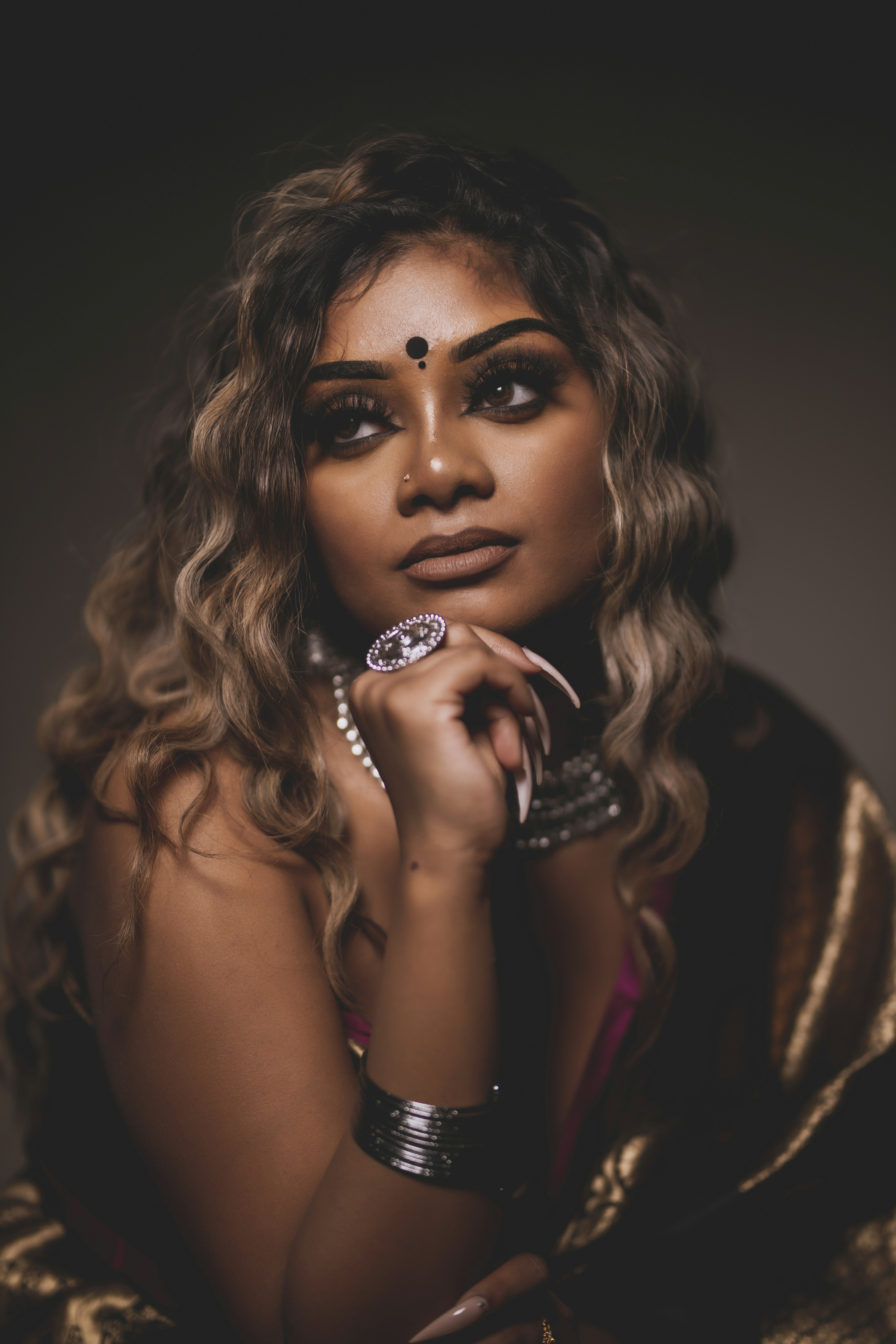 Midnight Bloom: A portrait of regal poise and silvery jewelry