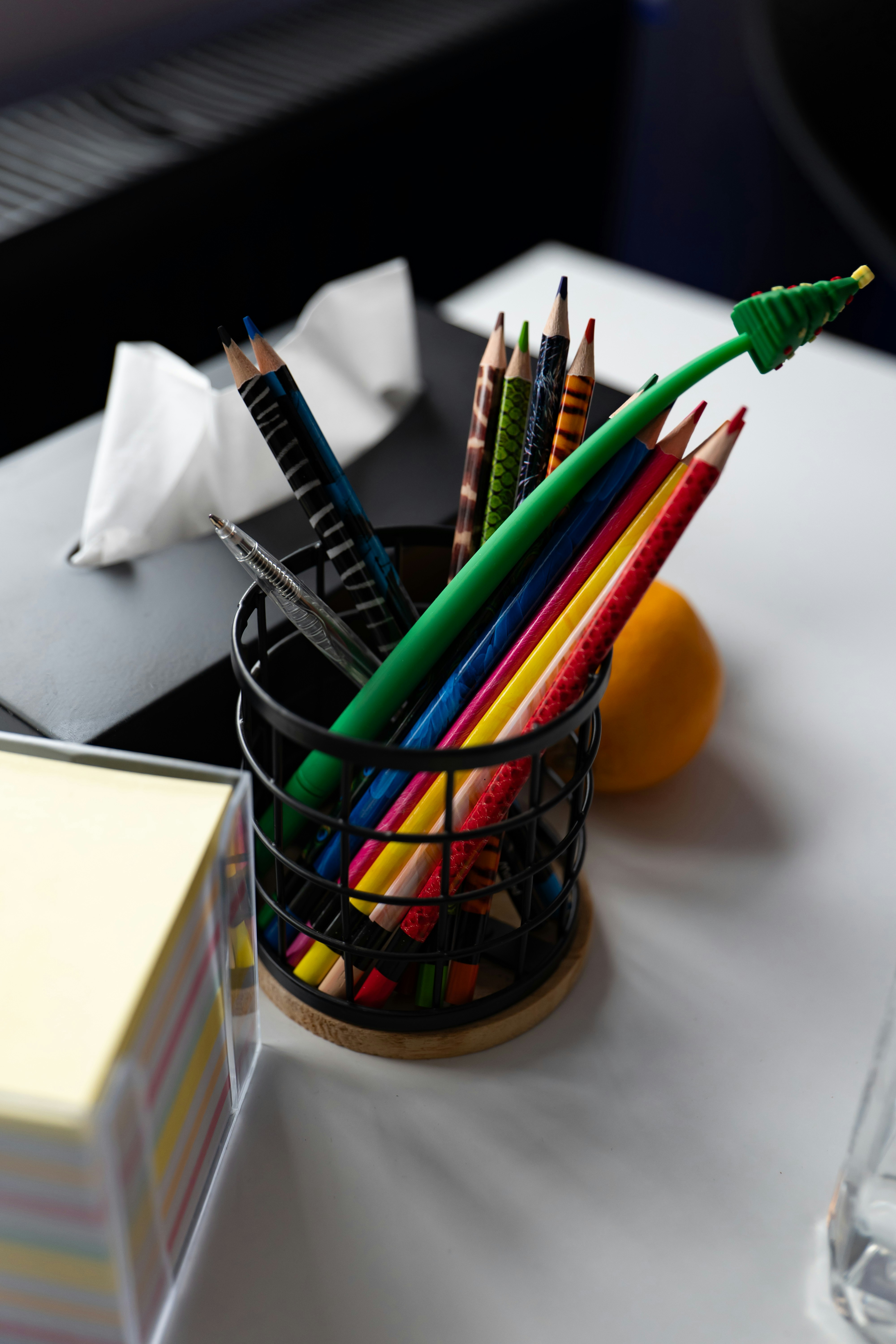 Colorful Pencil Tower in a Black Wire Cup on a Quiet Desk
