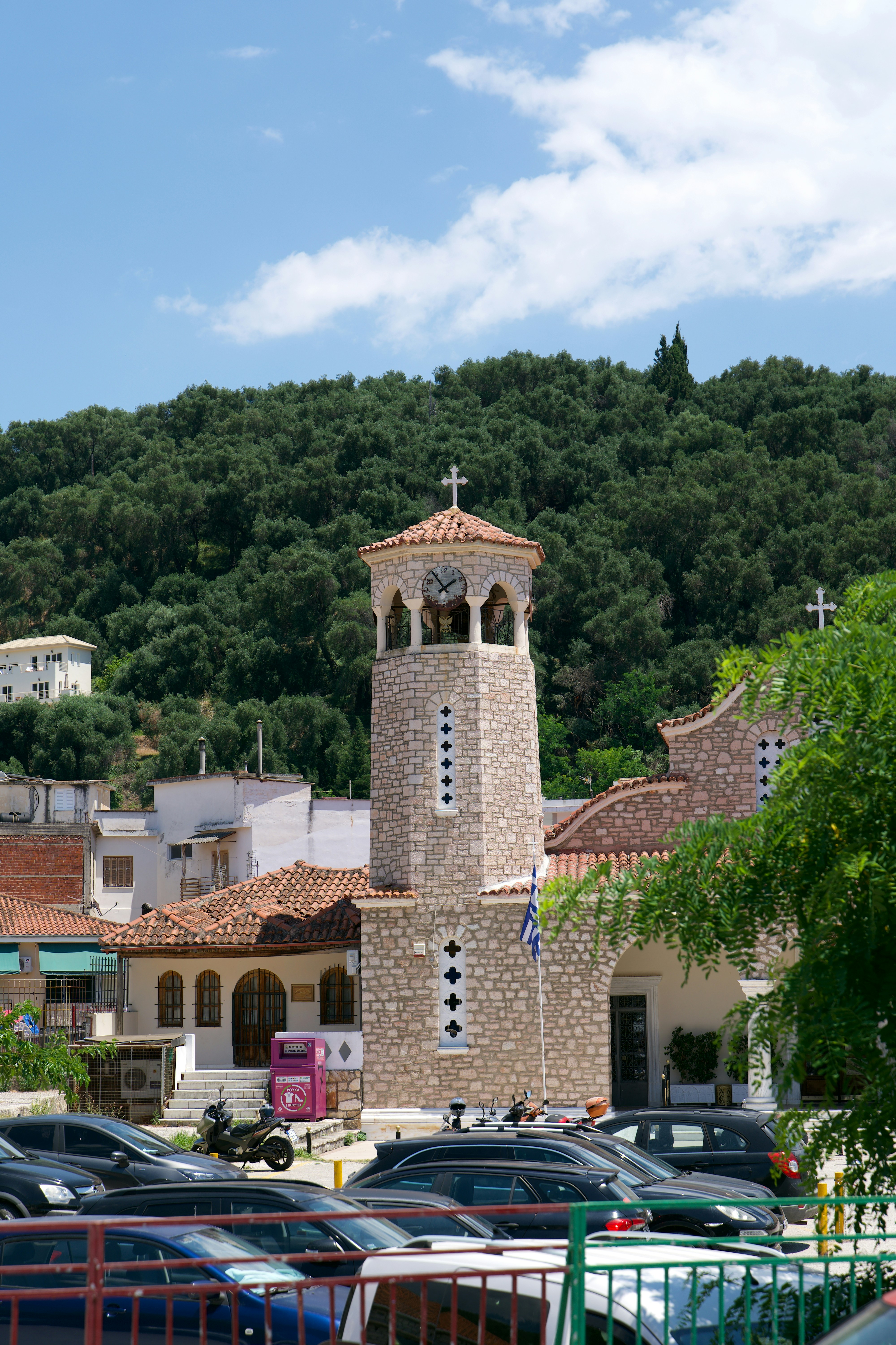 Stone Bell Tower Rising Over a Sunlit Coastal Village