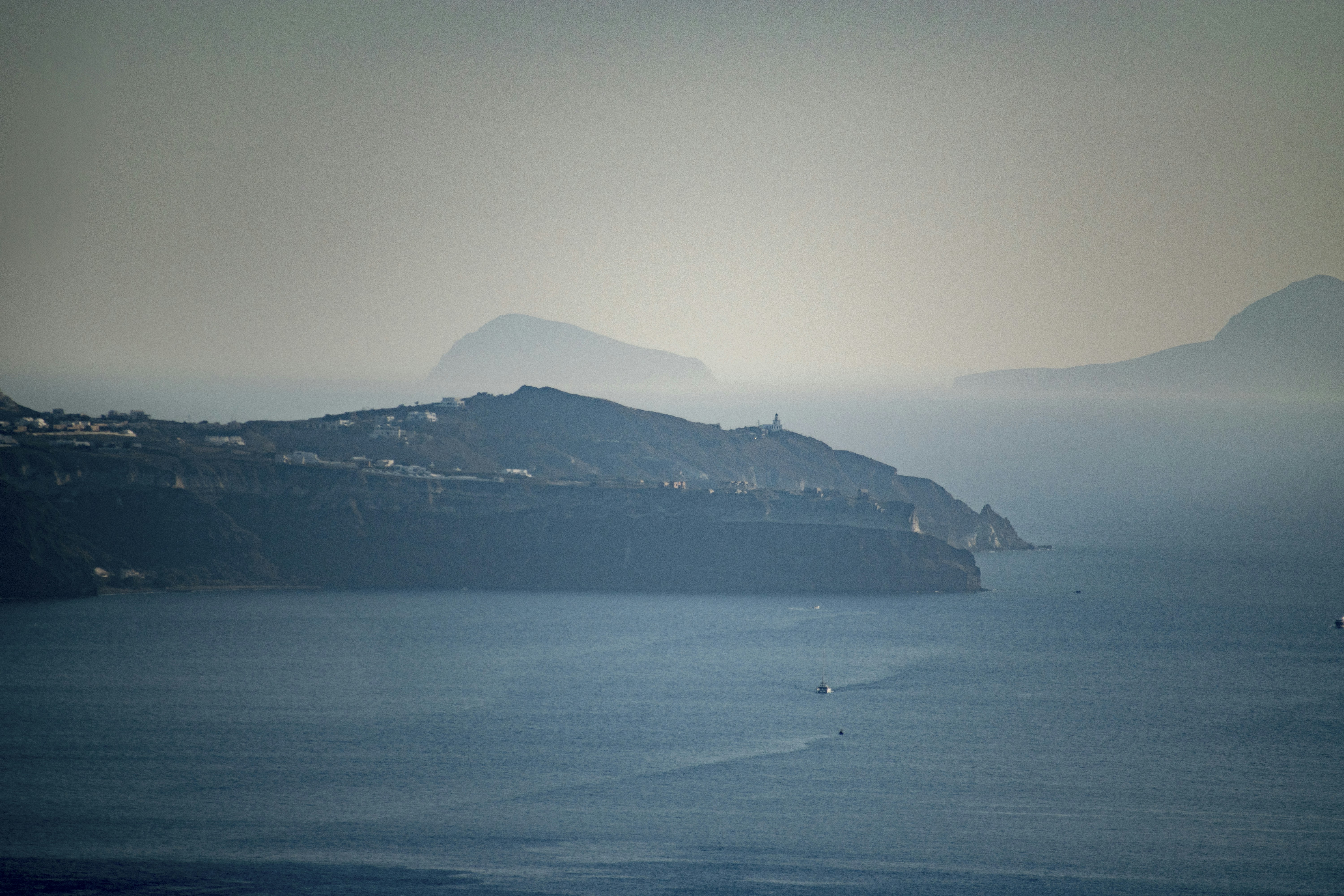 Mist Over the Adriatic: A Serene Cliffside Scene