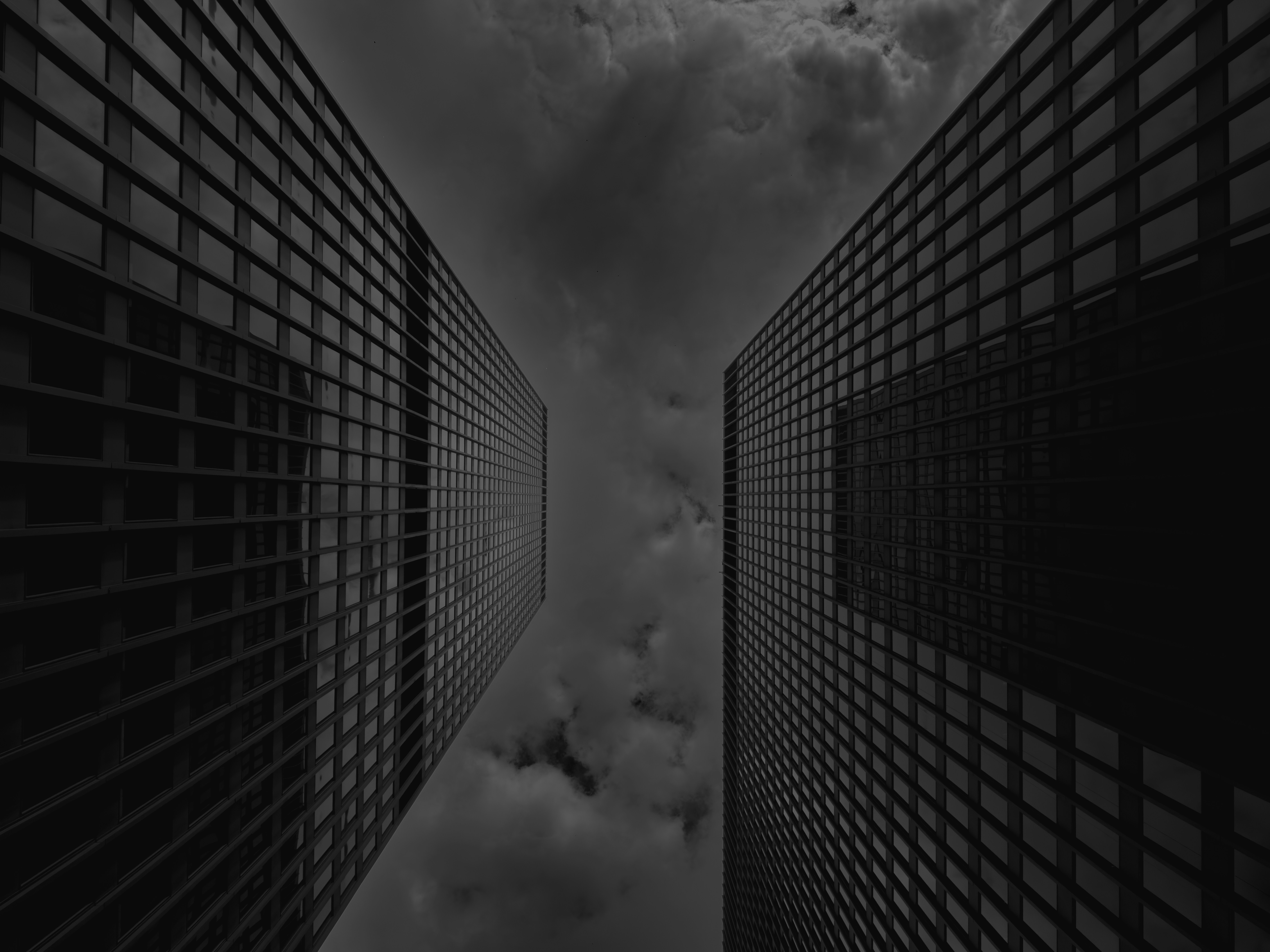 Skyward Monoliths: A Monochrome Gaze Between Skyscrapers