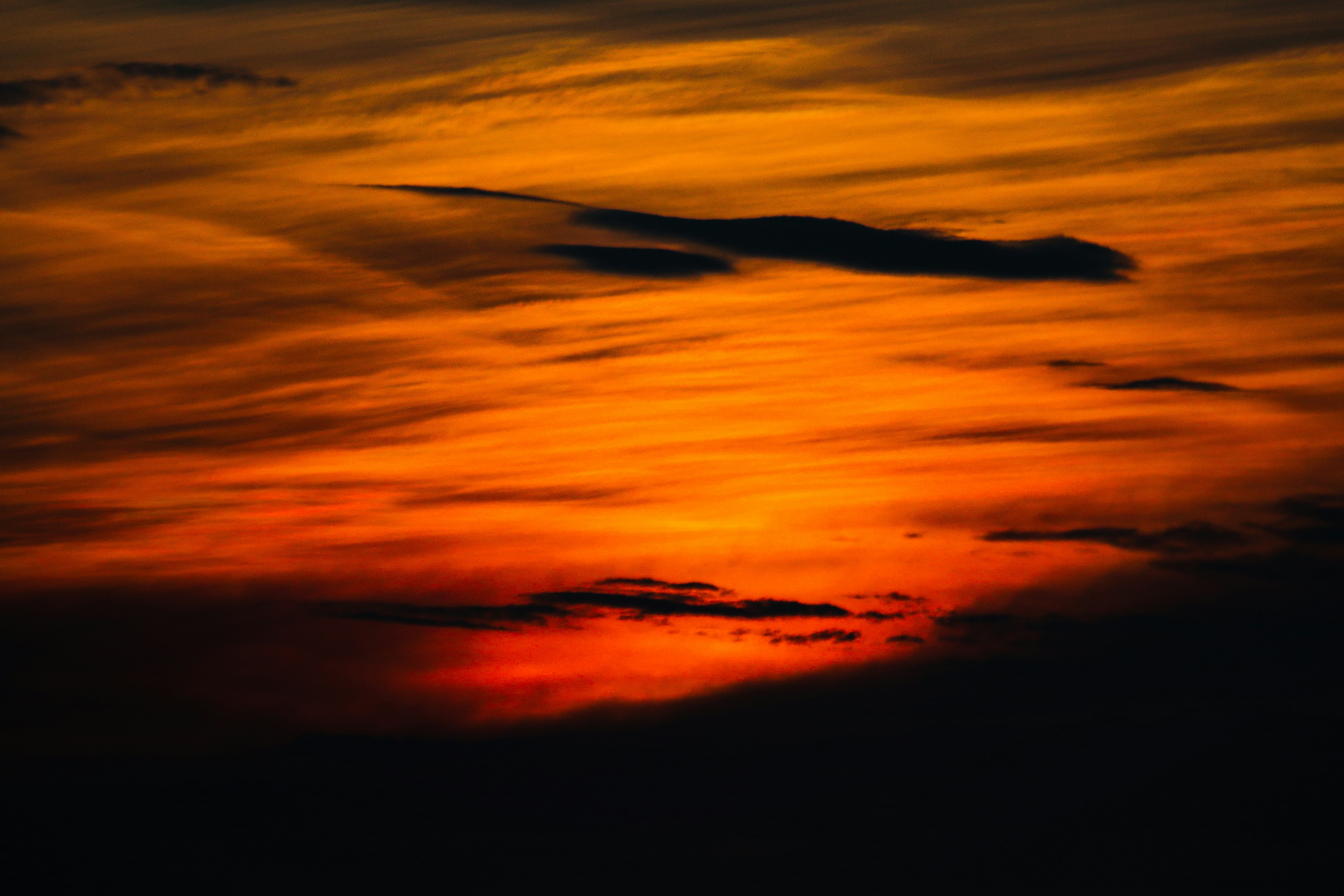 Crimson Horizon: Fiery Veil Over a Distant Horizon