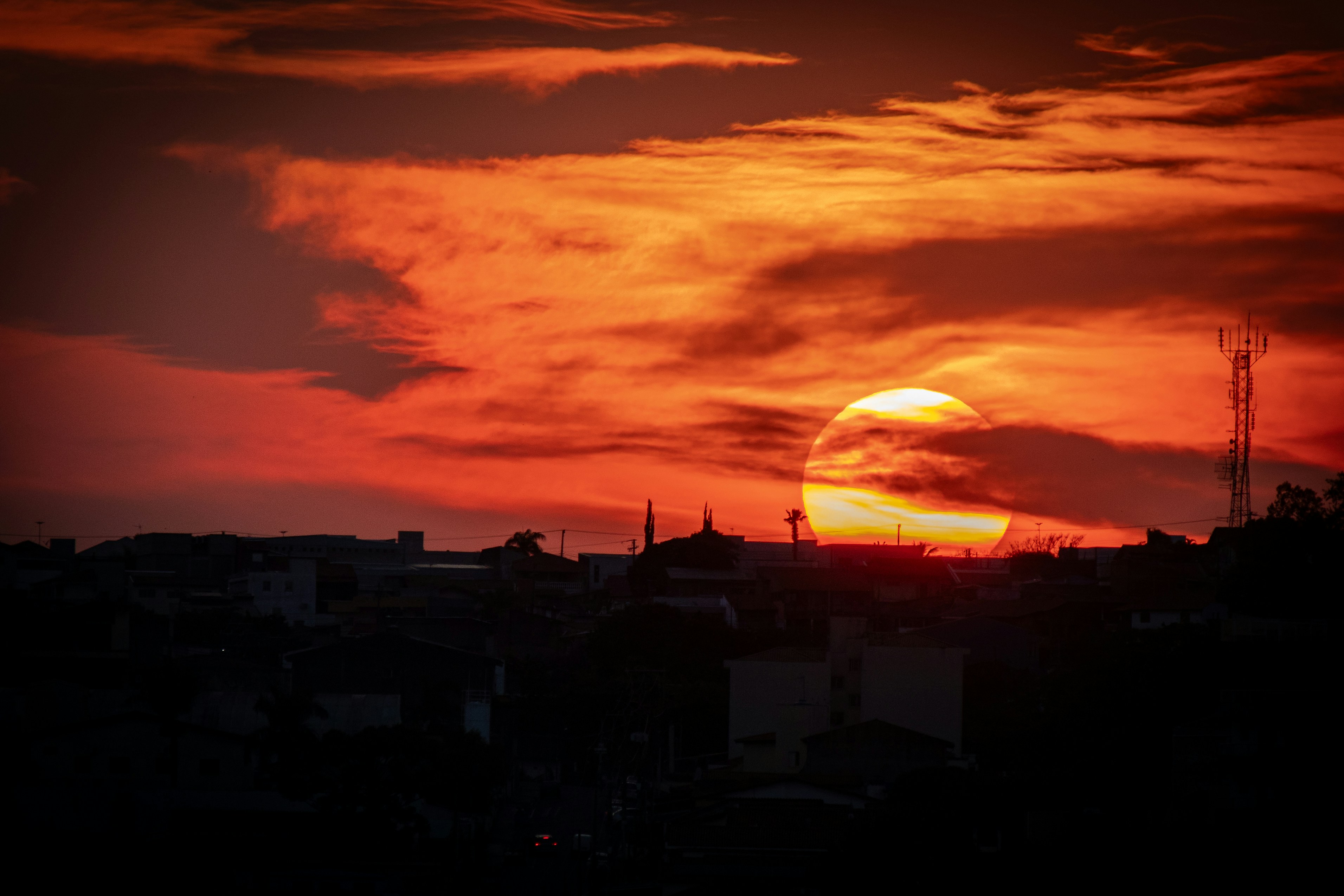 Crimson Sundown Over a Quiet Urban Horizon
