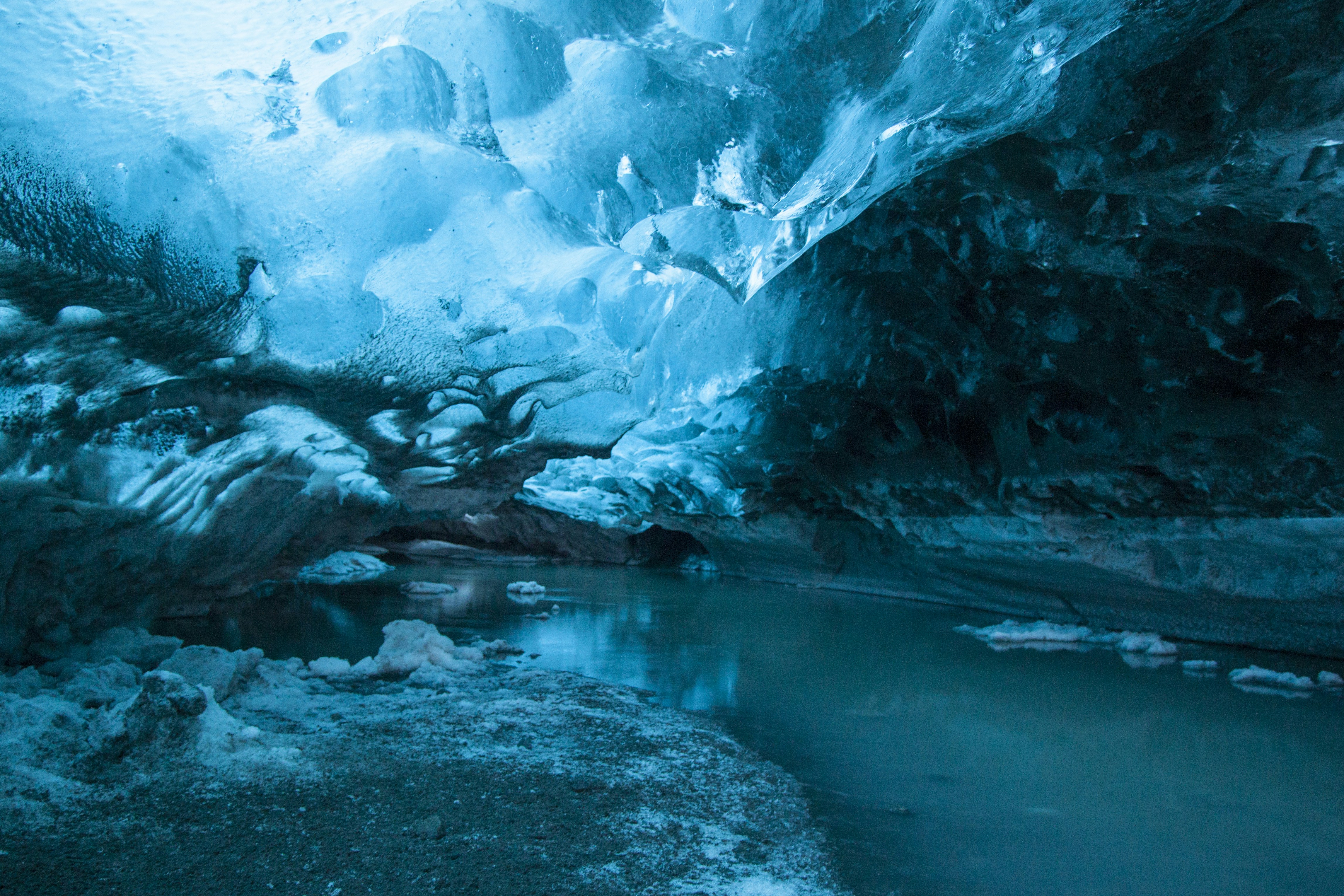 Icy Cathedral: A Blue-tinted Cavern with Glacial Light