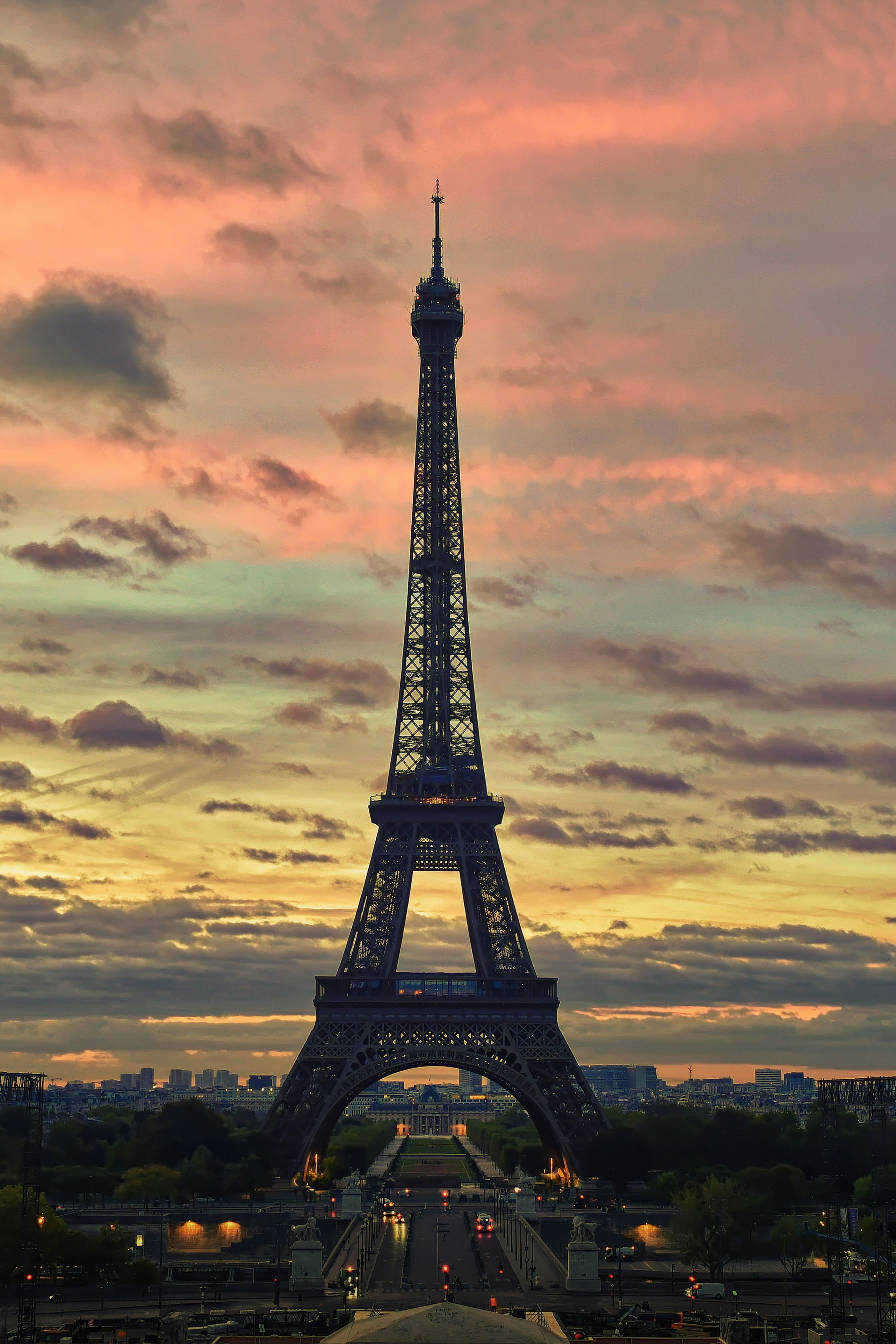 Paris Sunset Silhouette: The Eiffel Tower Tall Against a Peach Sky