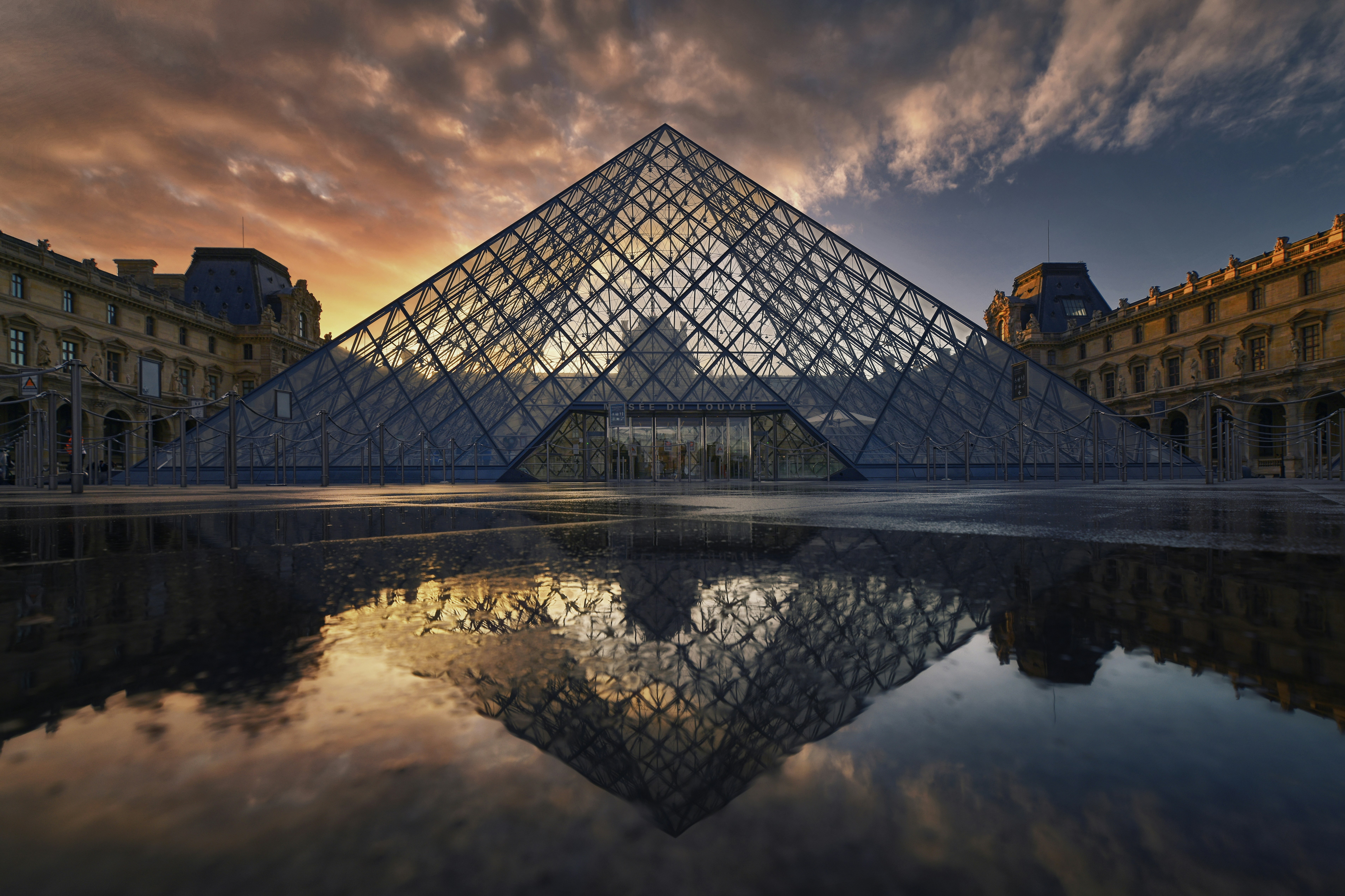 Reflected Glass: The Louvre Pyramid at Golden Hour