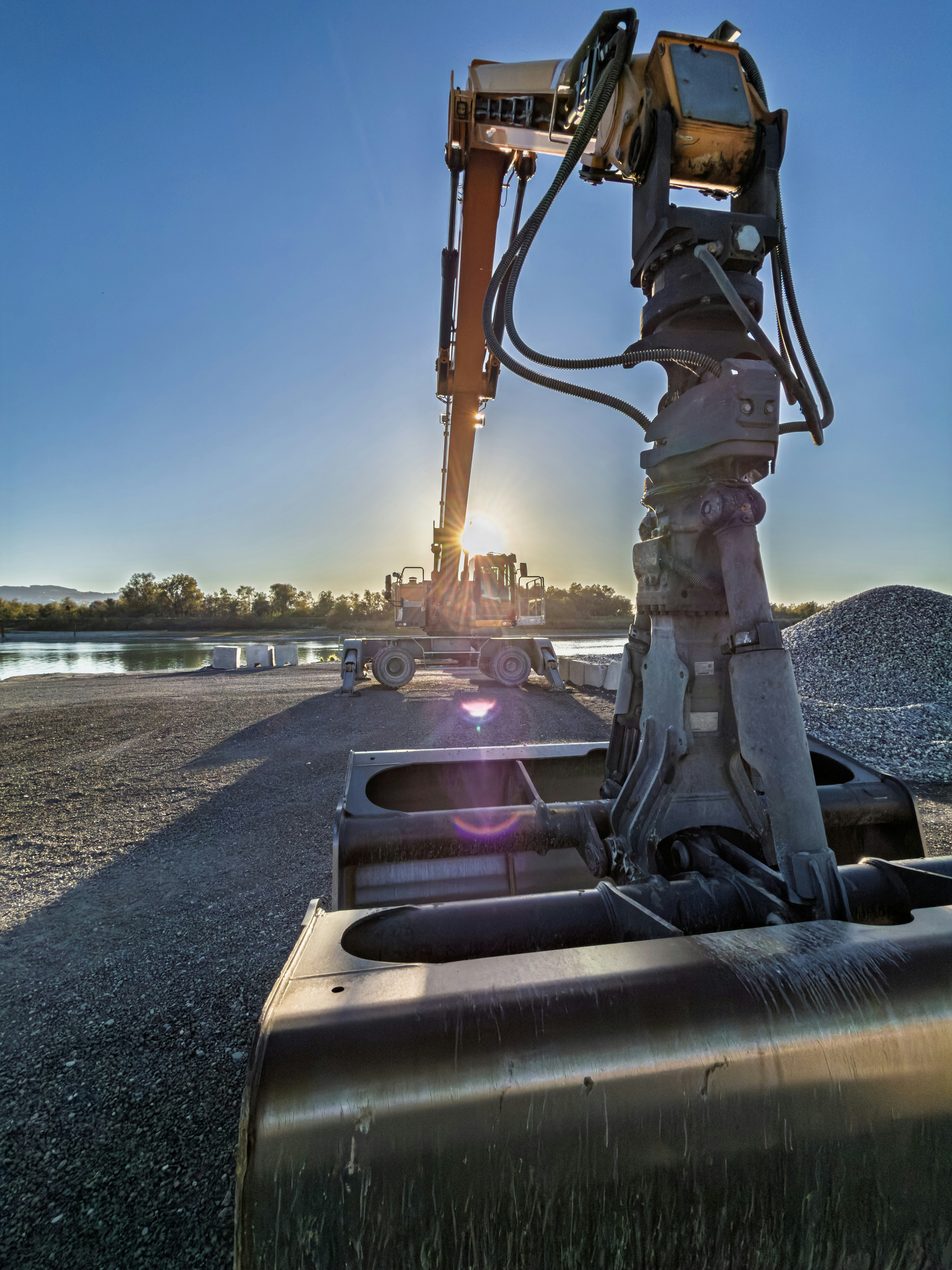 Sunrise Over Heavy Lifts: A Moment of Quarry Machinery in Action