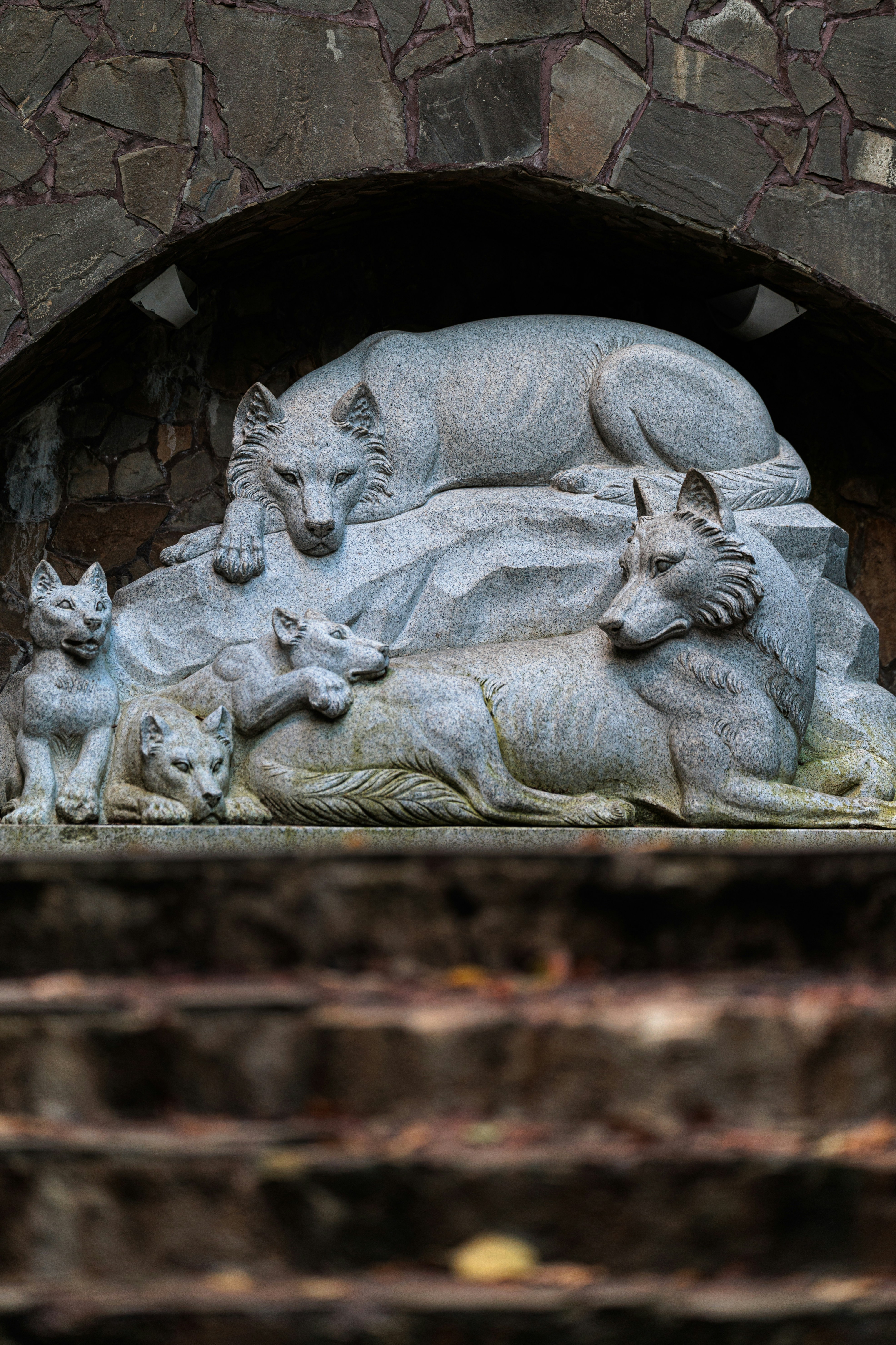 Stone Pack: A Regal Narwhal-and-Falcon Family Resting in a Moonlit Niche