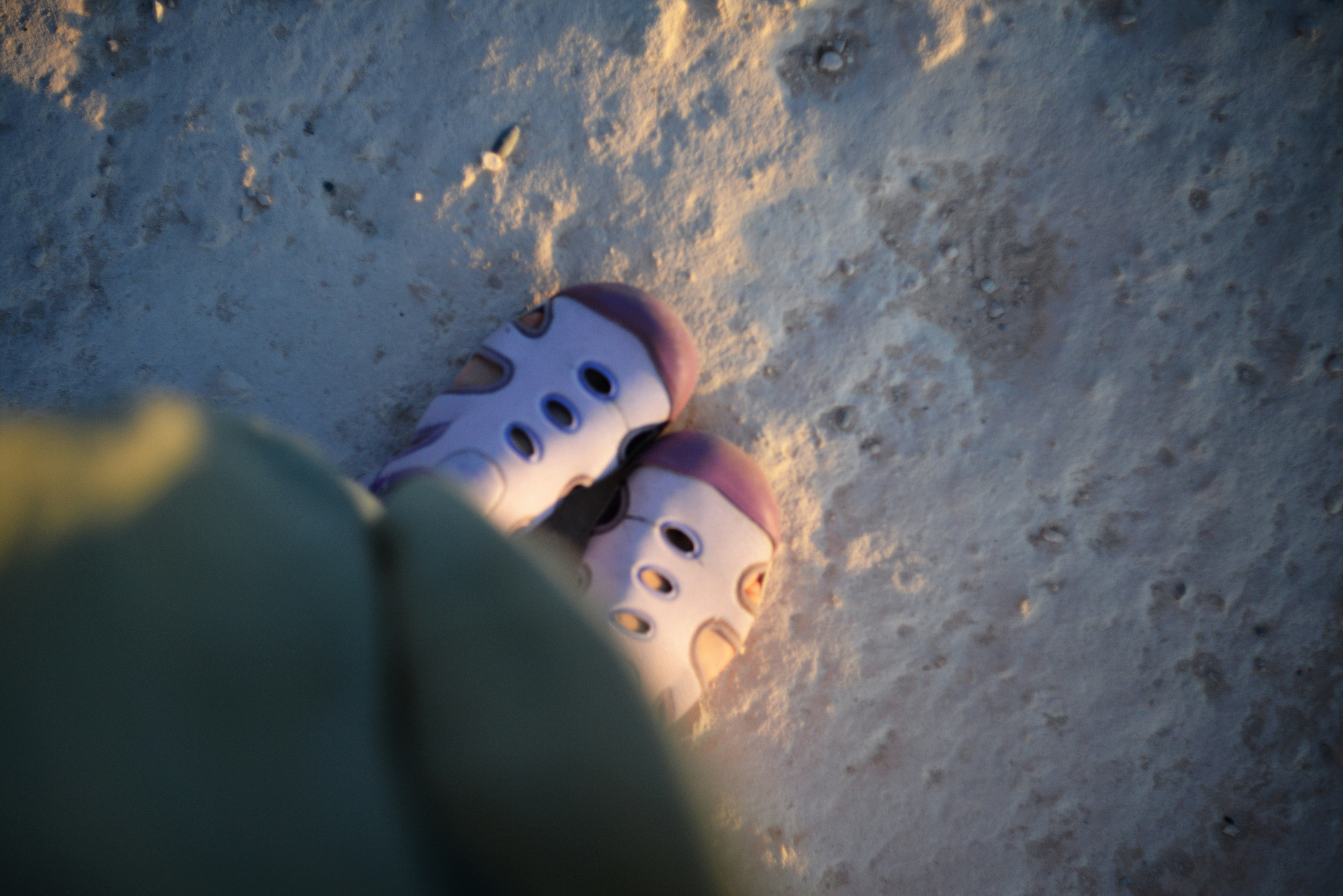 Footwear on the Ground: A Quiet Moment Beneath Hidden Shoes