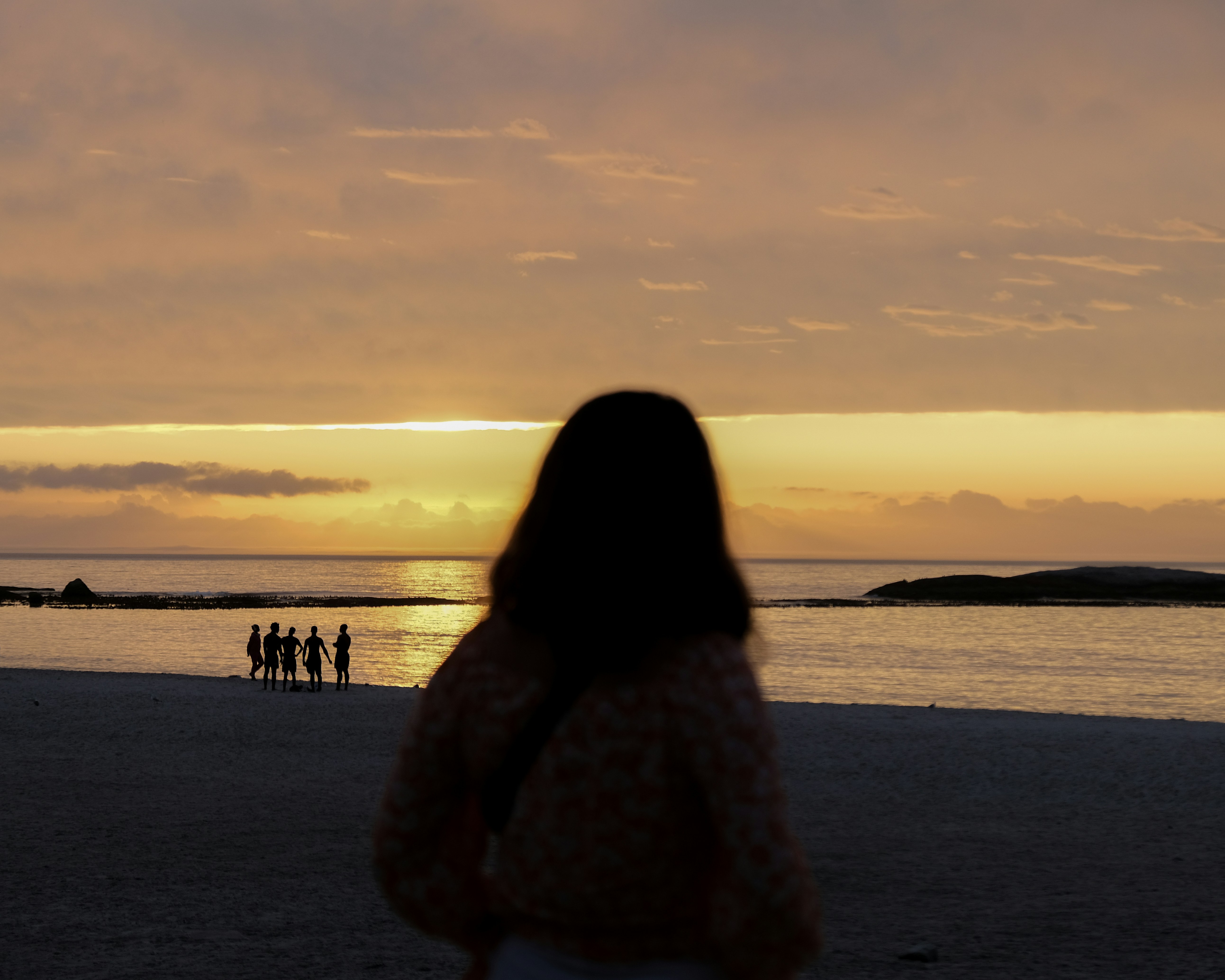 Silhouette in the Golden Hour: A Quiet Beach Moment