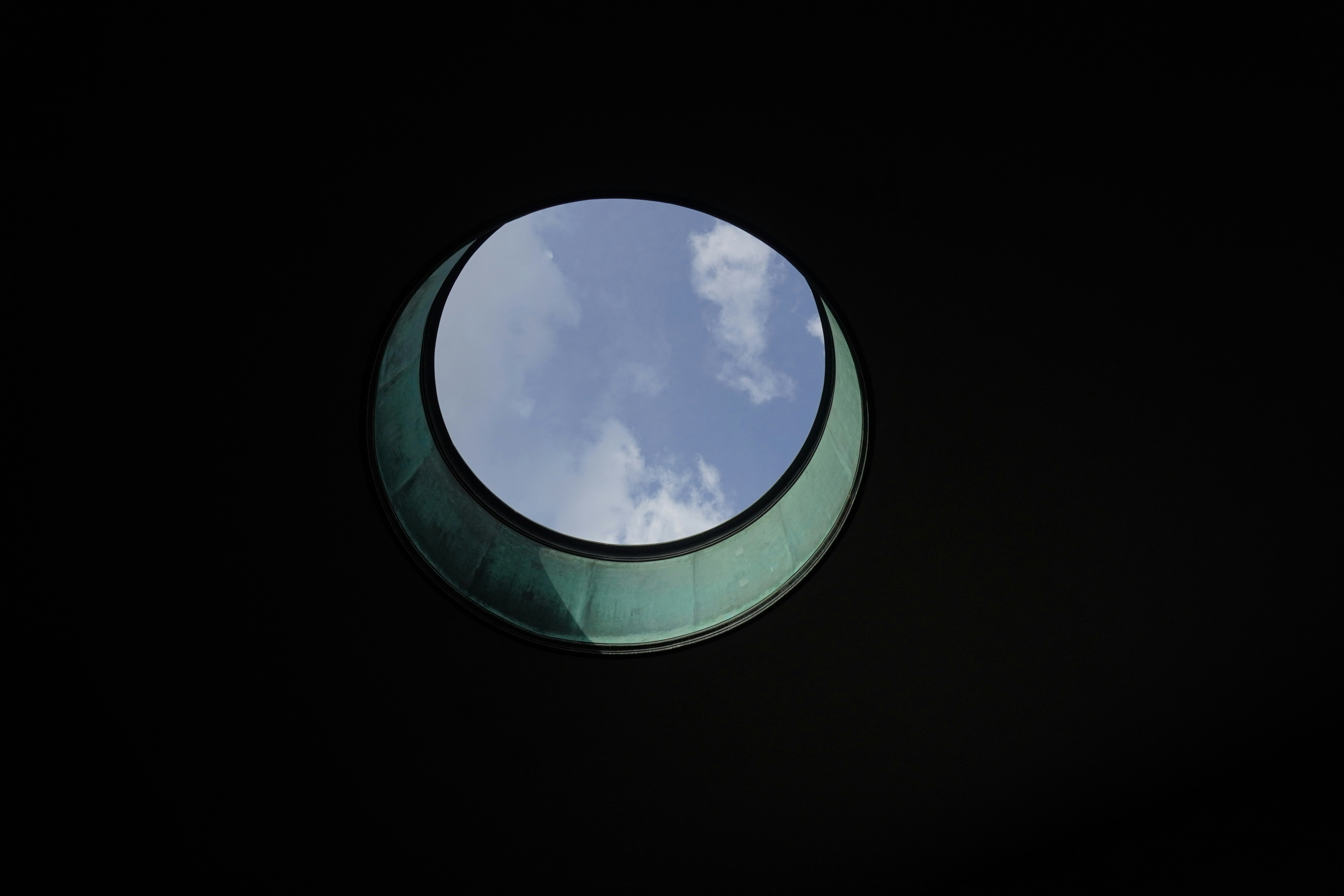Circular Sky Window: Blue Patch Surrounded by Night