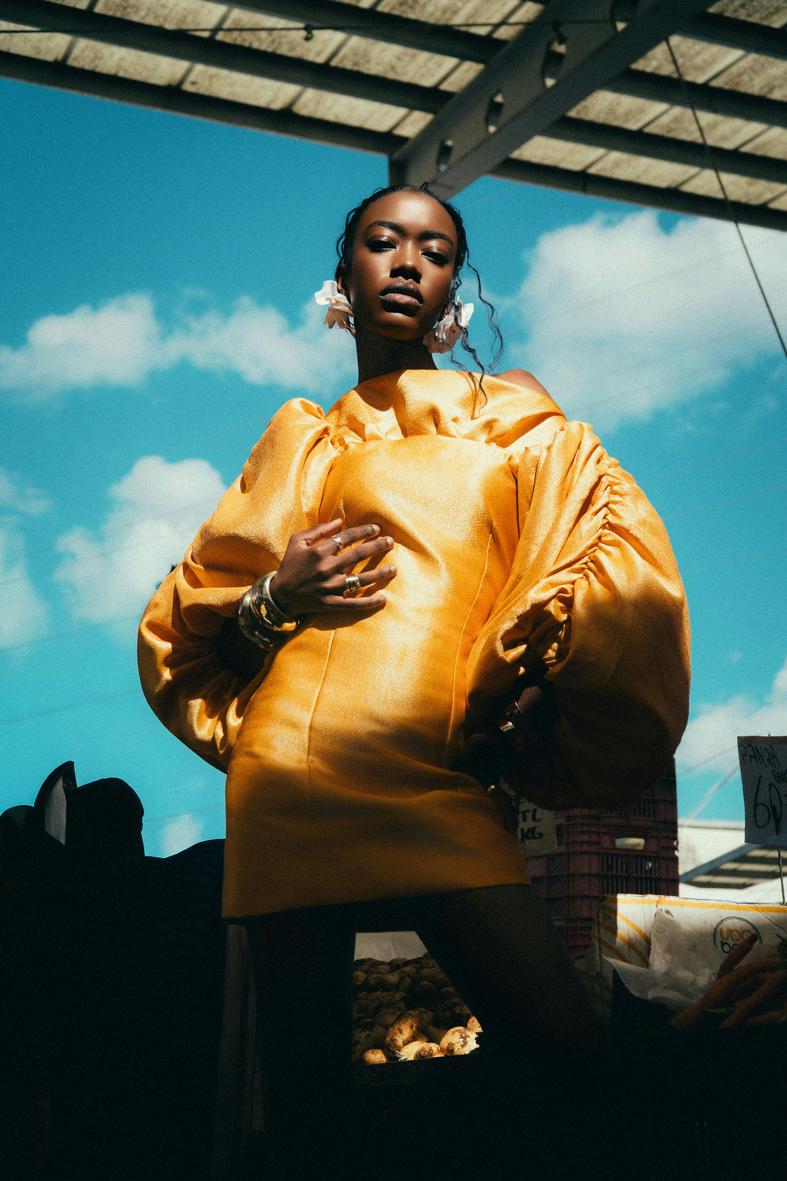 Golden Silhouette: Fashion in Sunlit Urban Sky