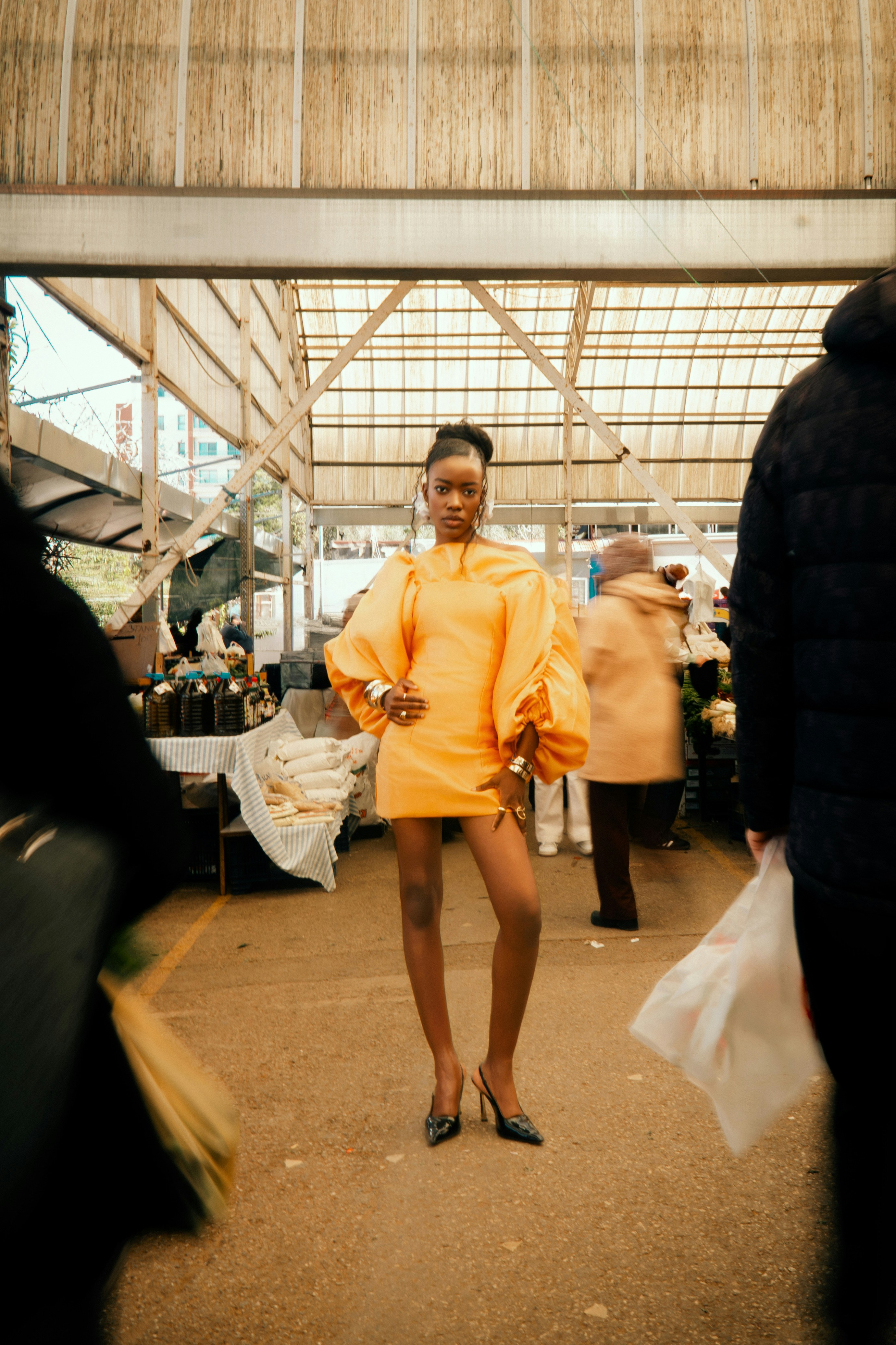 Orange Reverie: A Fashion Moment Under the Market Canopy