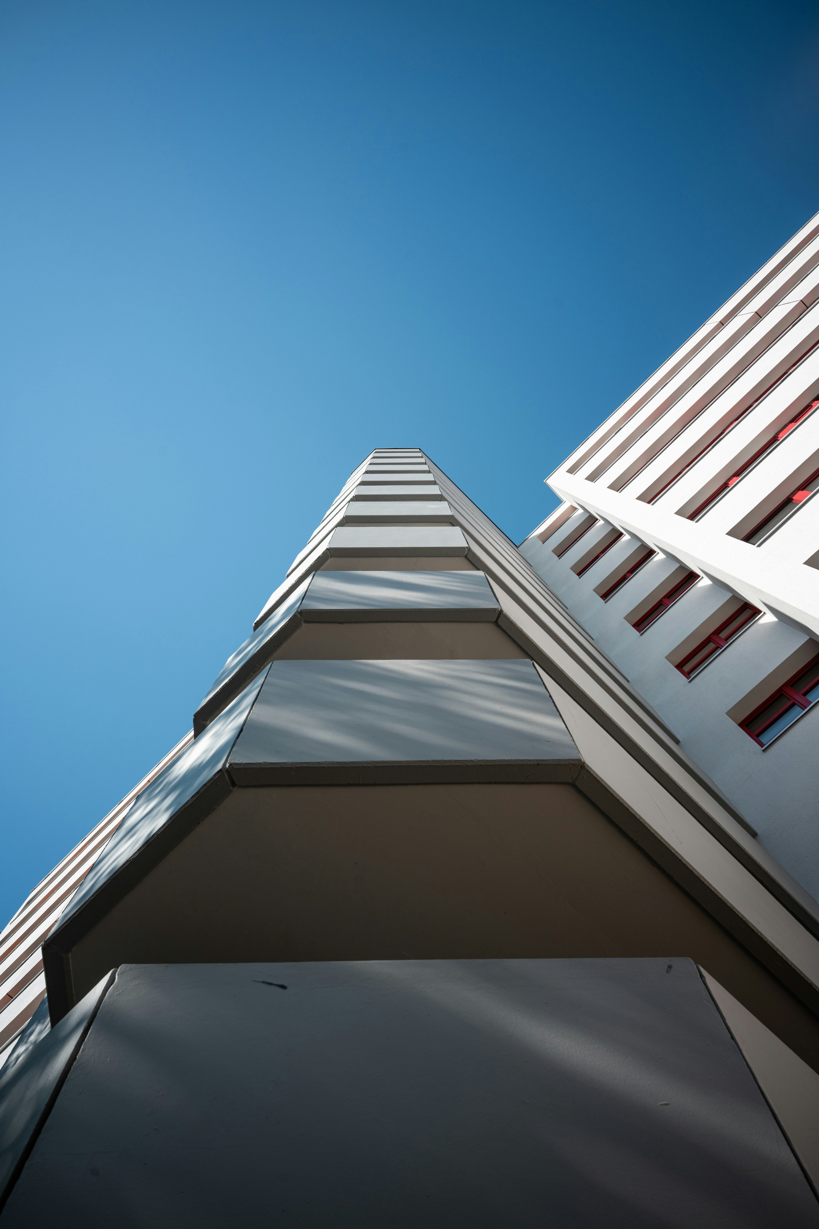 Ascending Facade: A Tilted Perspective Toward the Sky