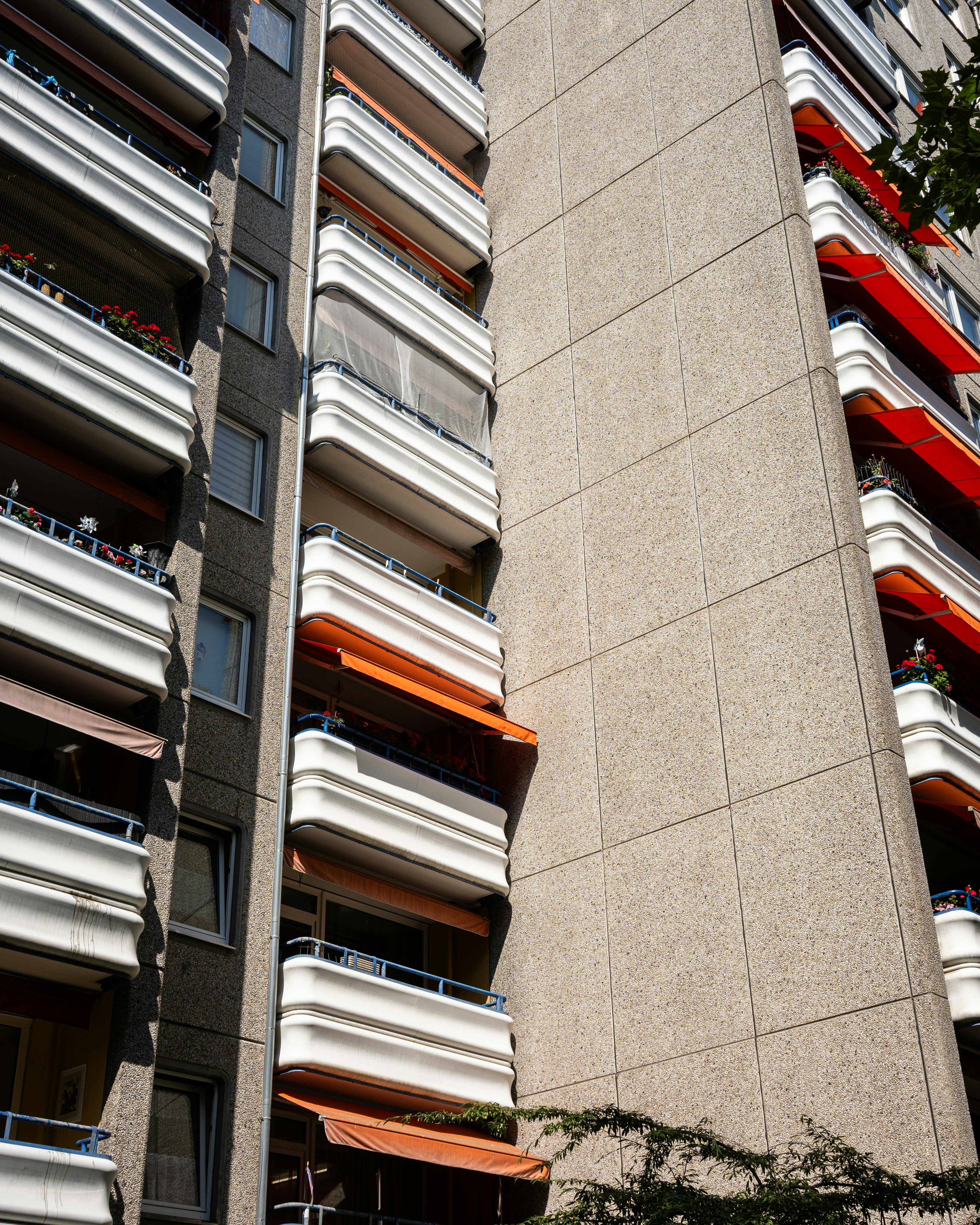 Balconies in Parallel: A Facade of Color and Concrete