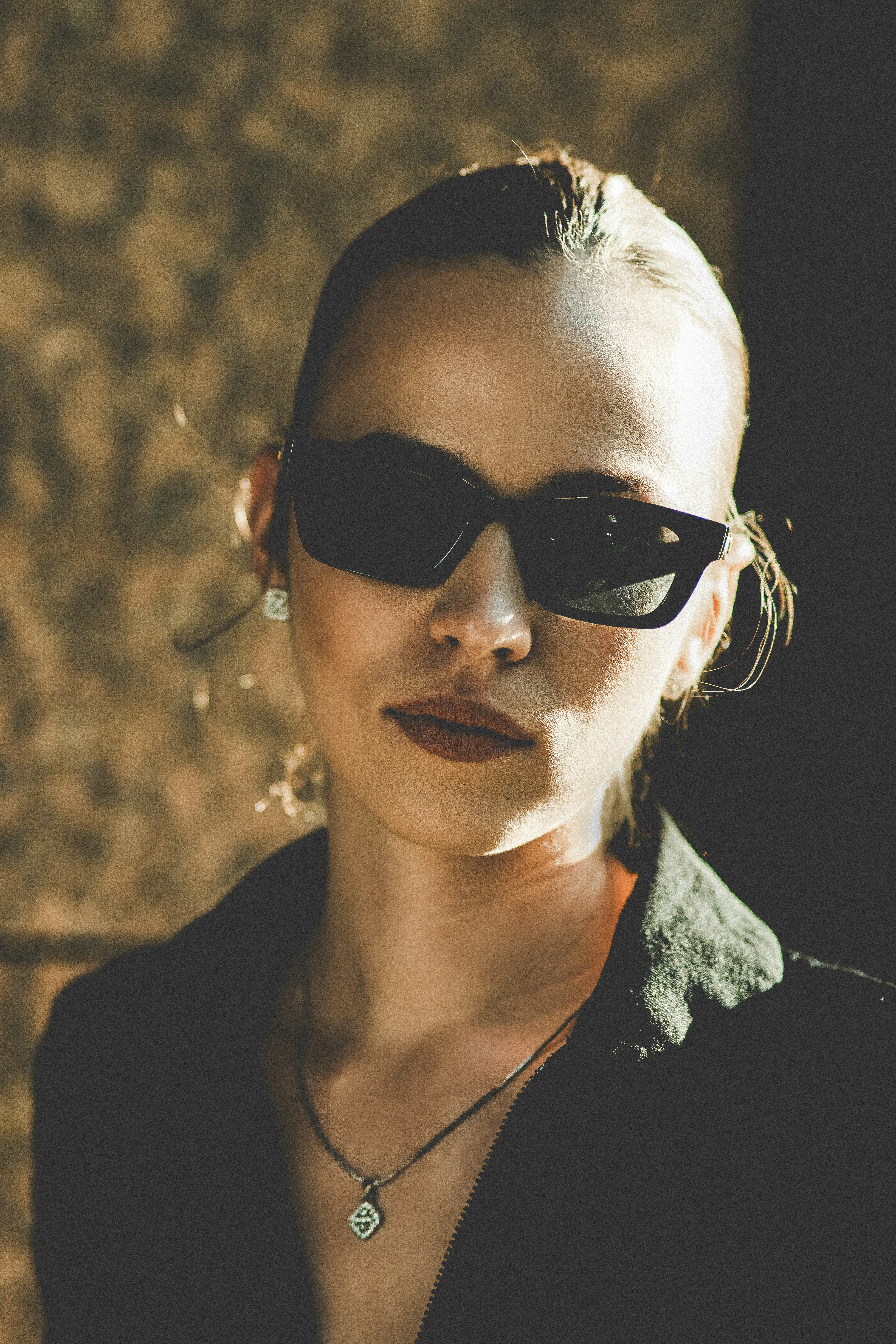 Shaded Confidence: A Bold Portrait in Soft Light